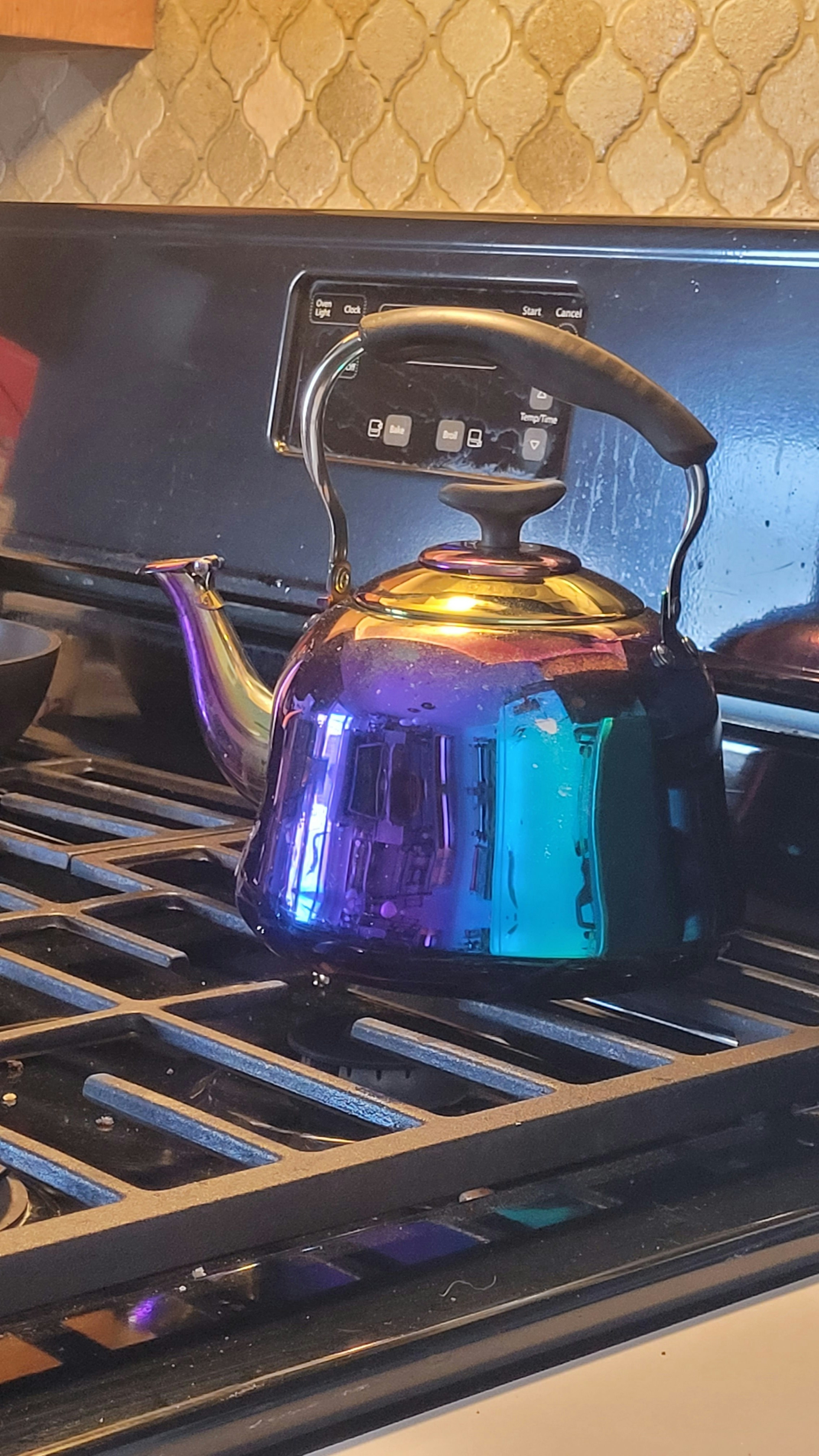 Chromatic Kettle on a Quiet Flame: Reflections and Color in a Domestic Kitchen