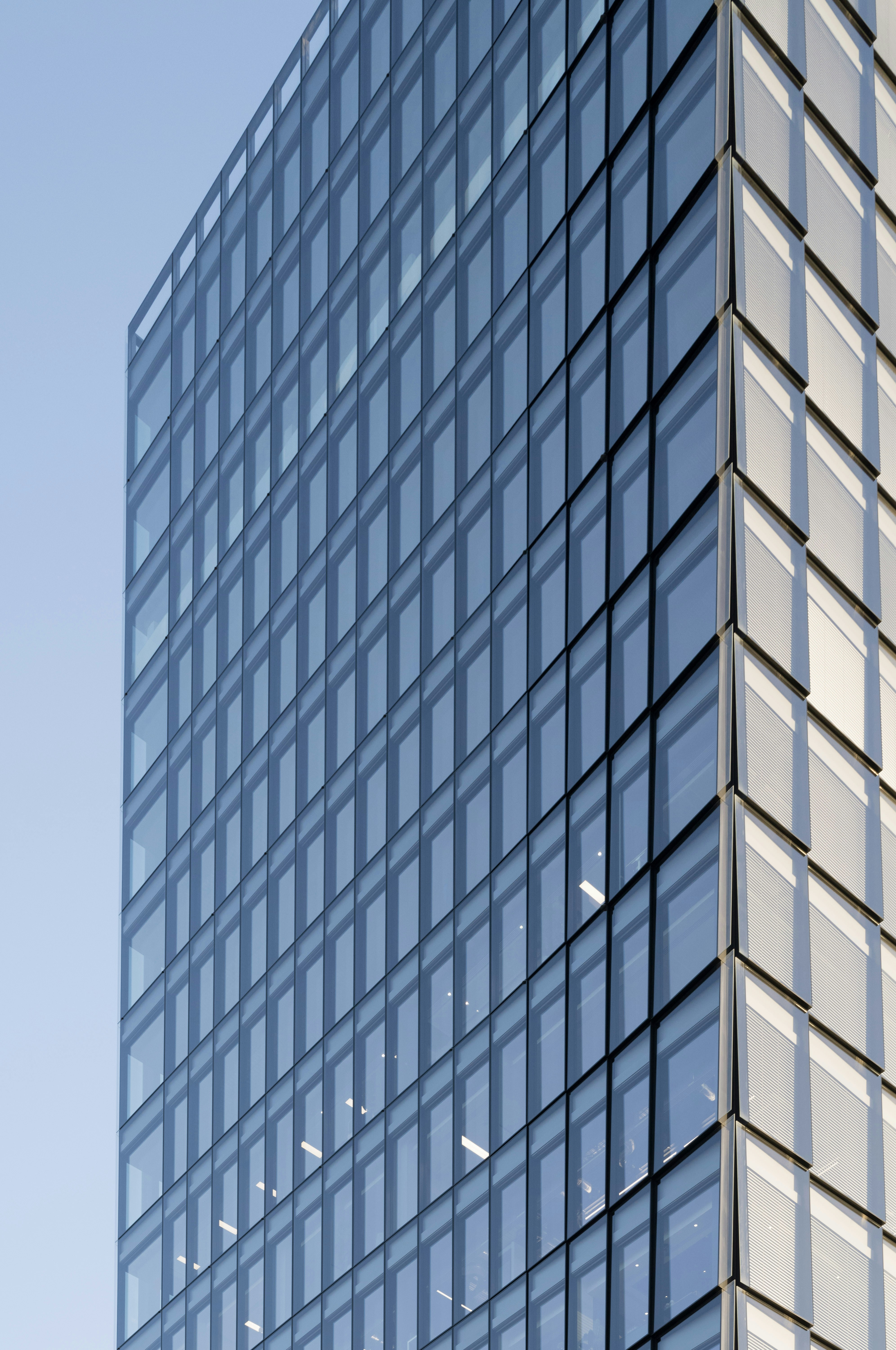 A very tall building with lots of windows photo – Free City Image on ...