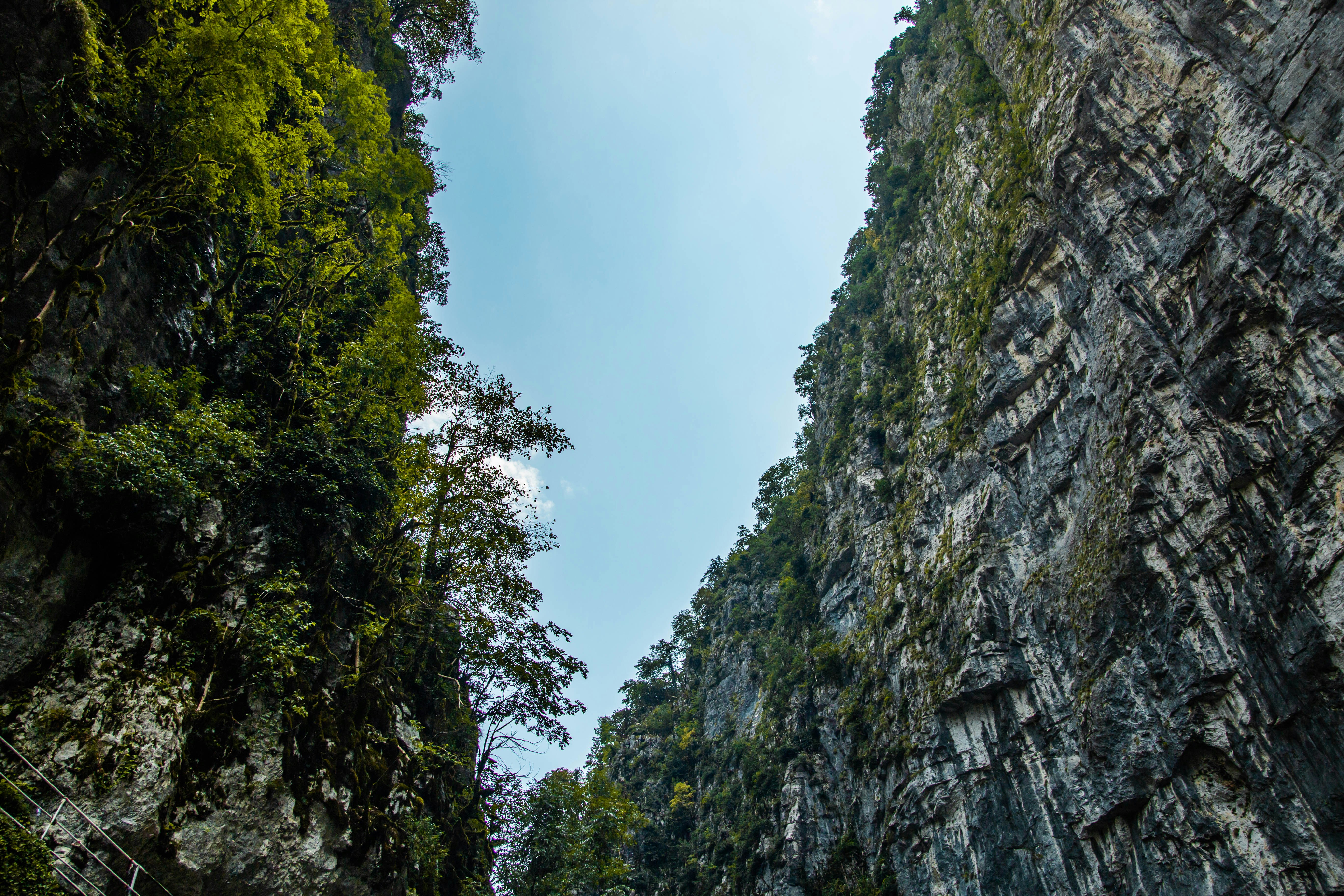 A view of a narrow road between two mountains photo – Free Абхазия ...