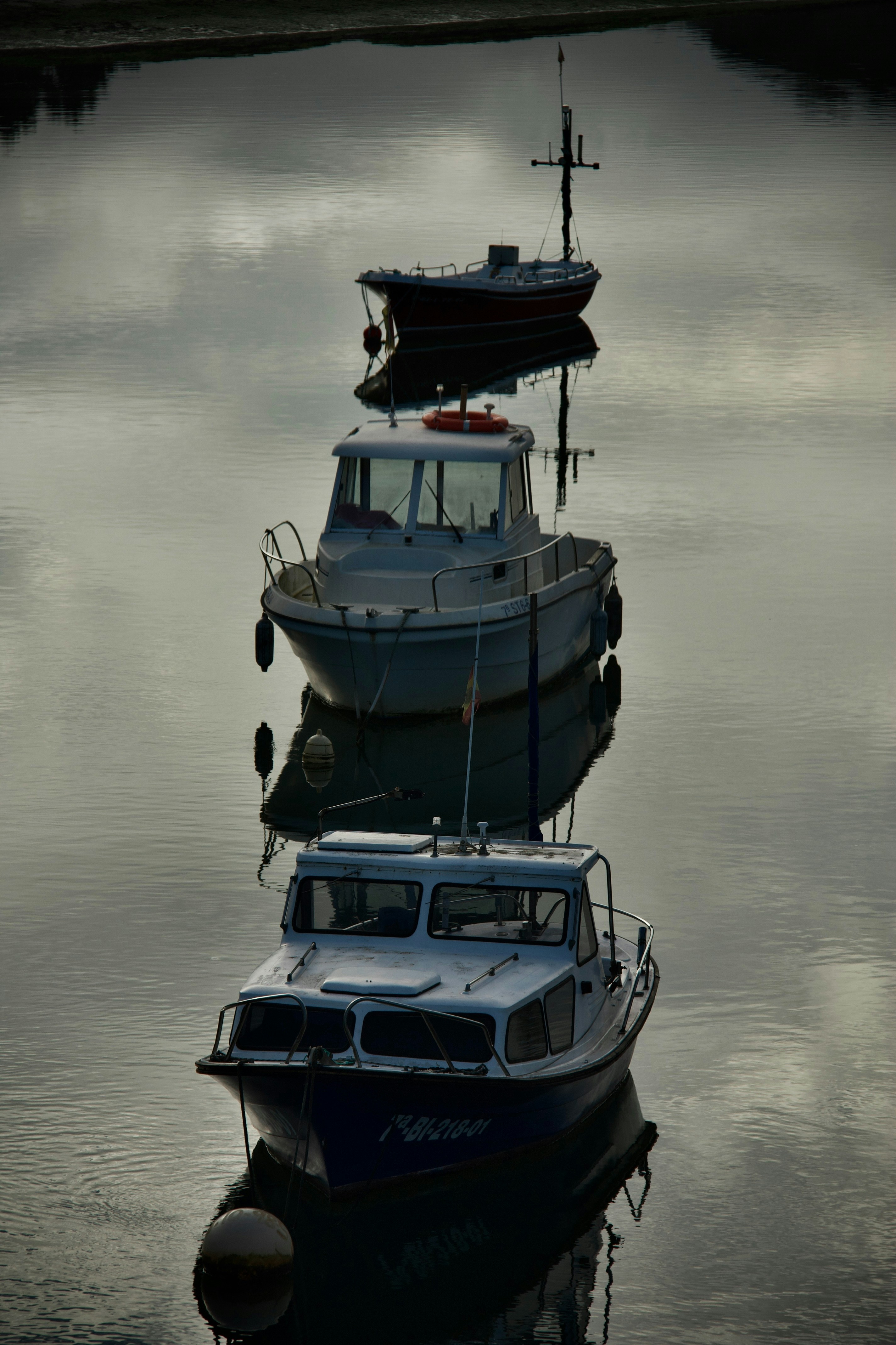 Dusk Harbour: Three Boats and Their Mirror Image