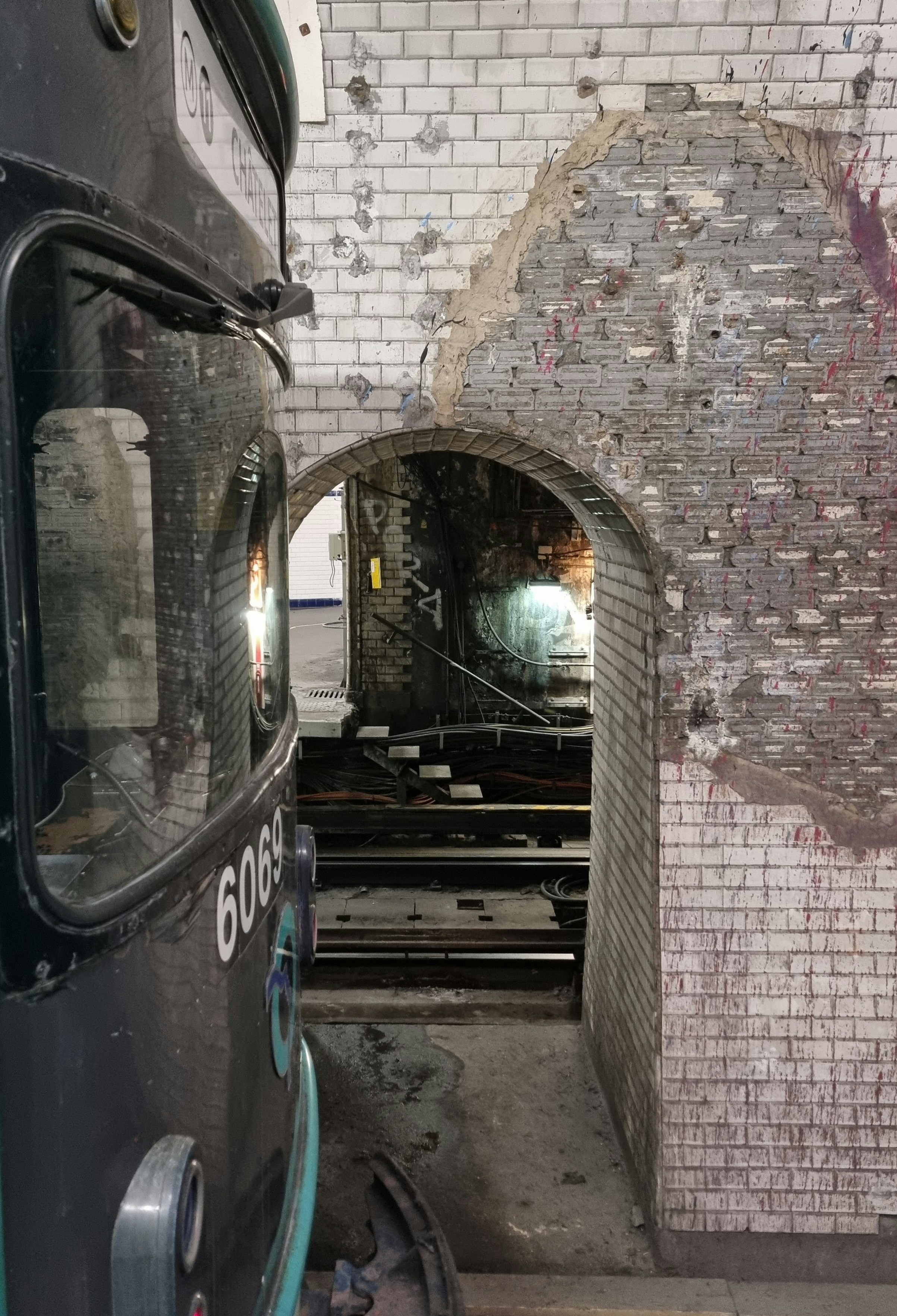 a subway car with graffiti on the side of it
