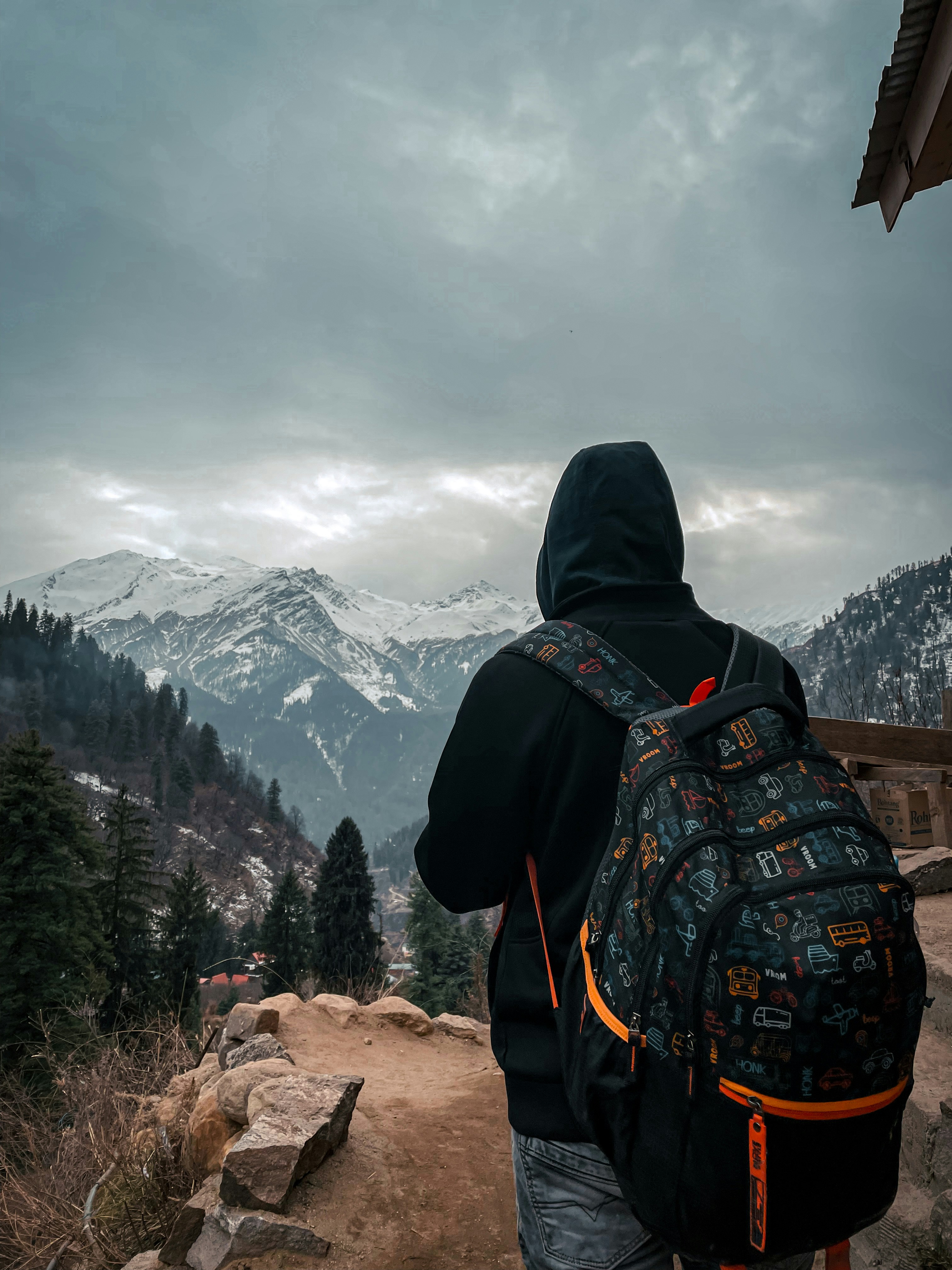 A person with a backpack looking at the mountains photo – Free Tosh ...