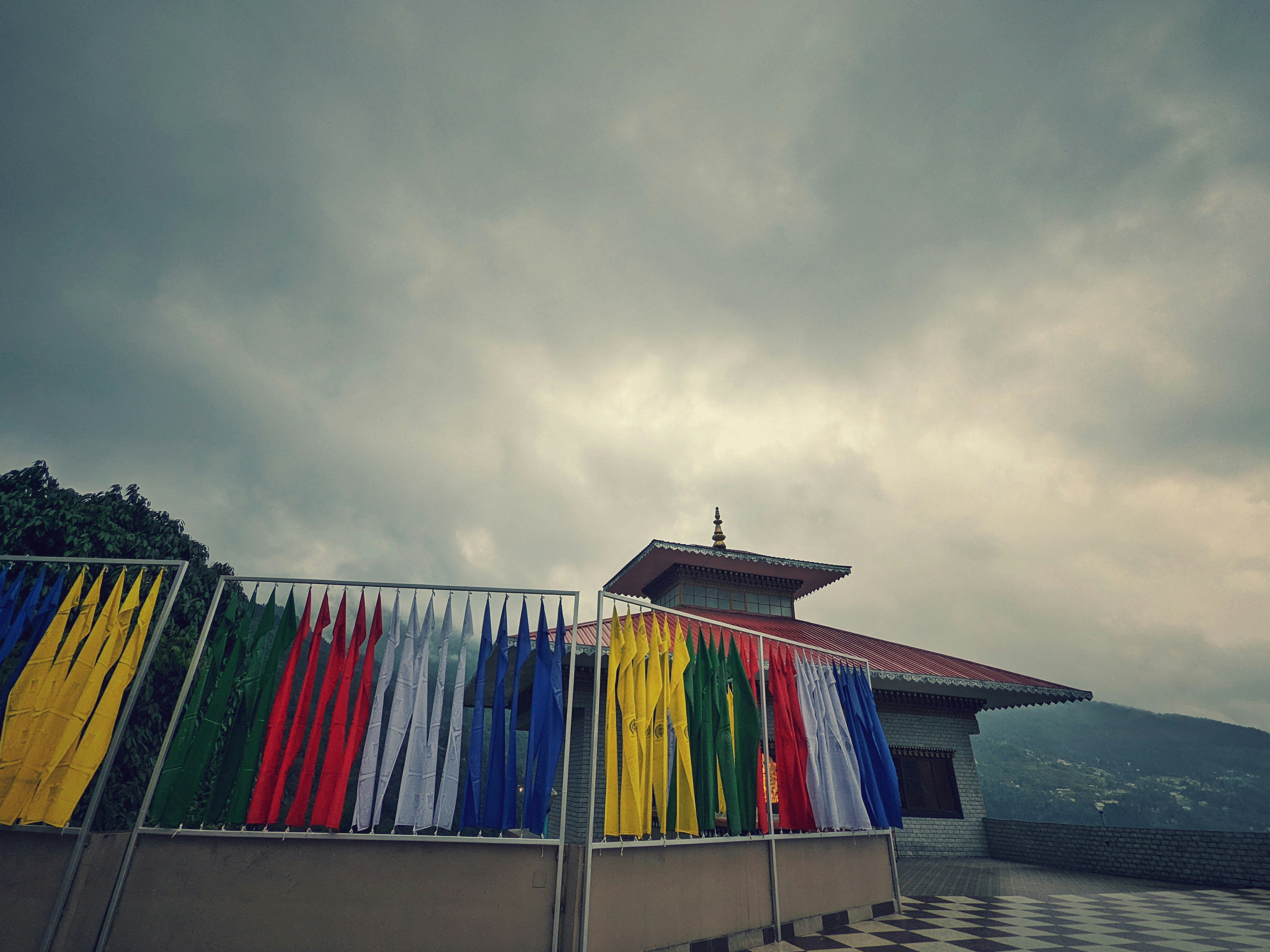 Prayer Flags on a Mountain Terrace: Color Amid Clouds
