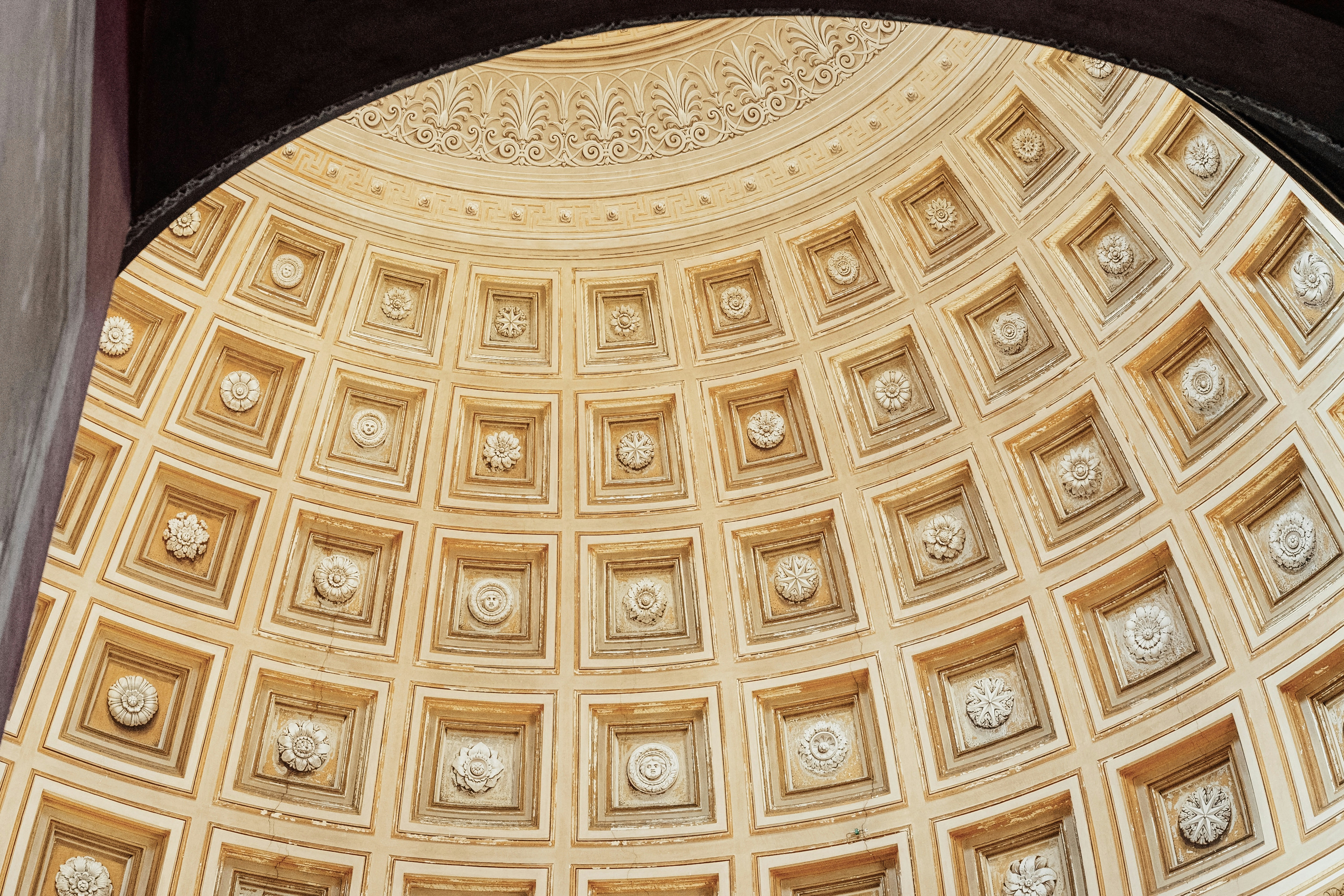 Coffered Dome Constellation: Warm Light Navigates Repeating Rosette Panels