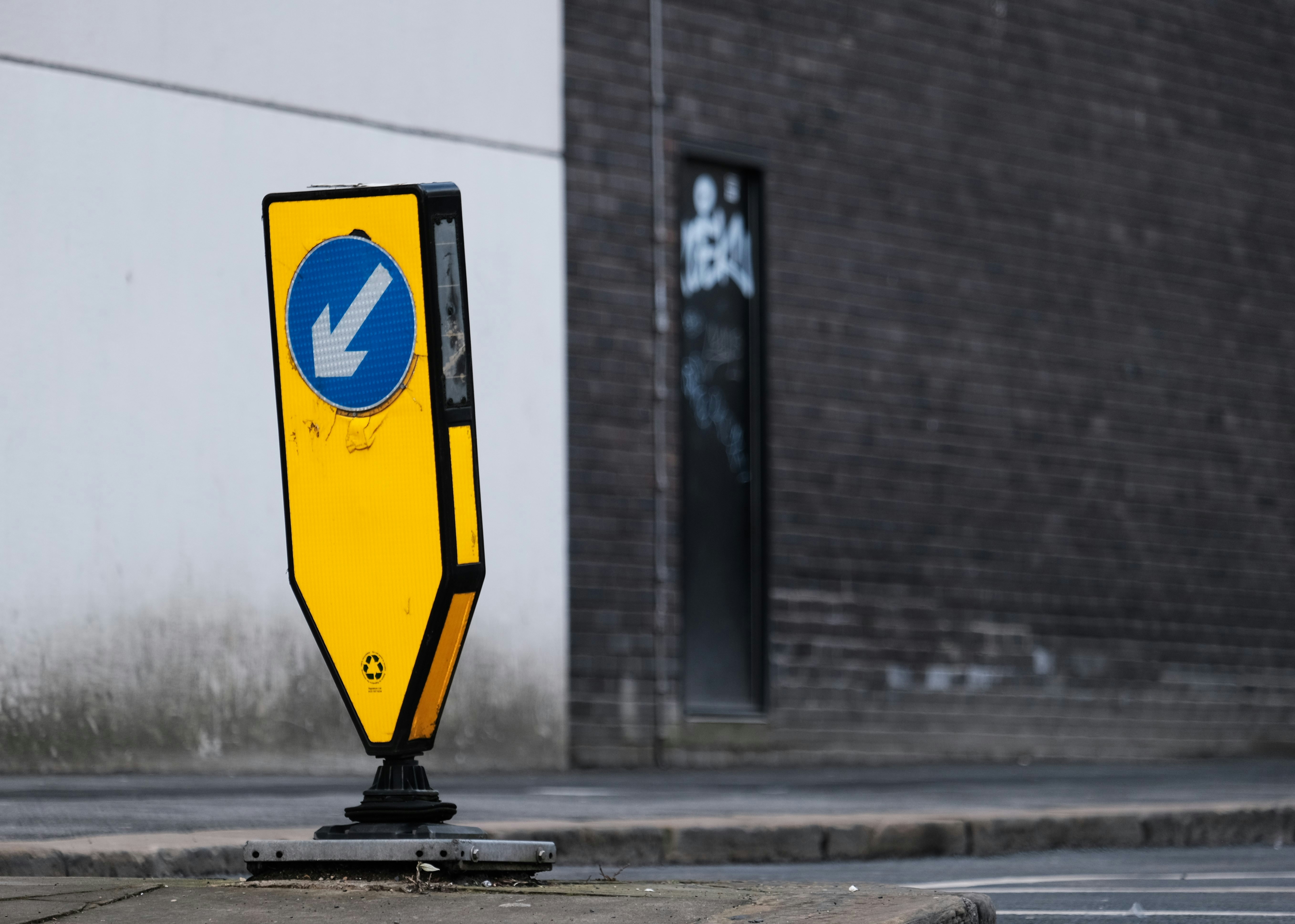 A yellow street sign sitting on the side of a road photo – Free Uk ...