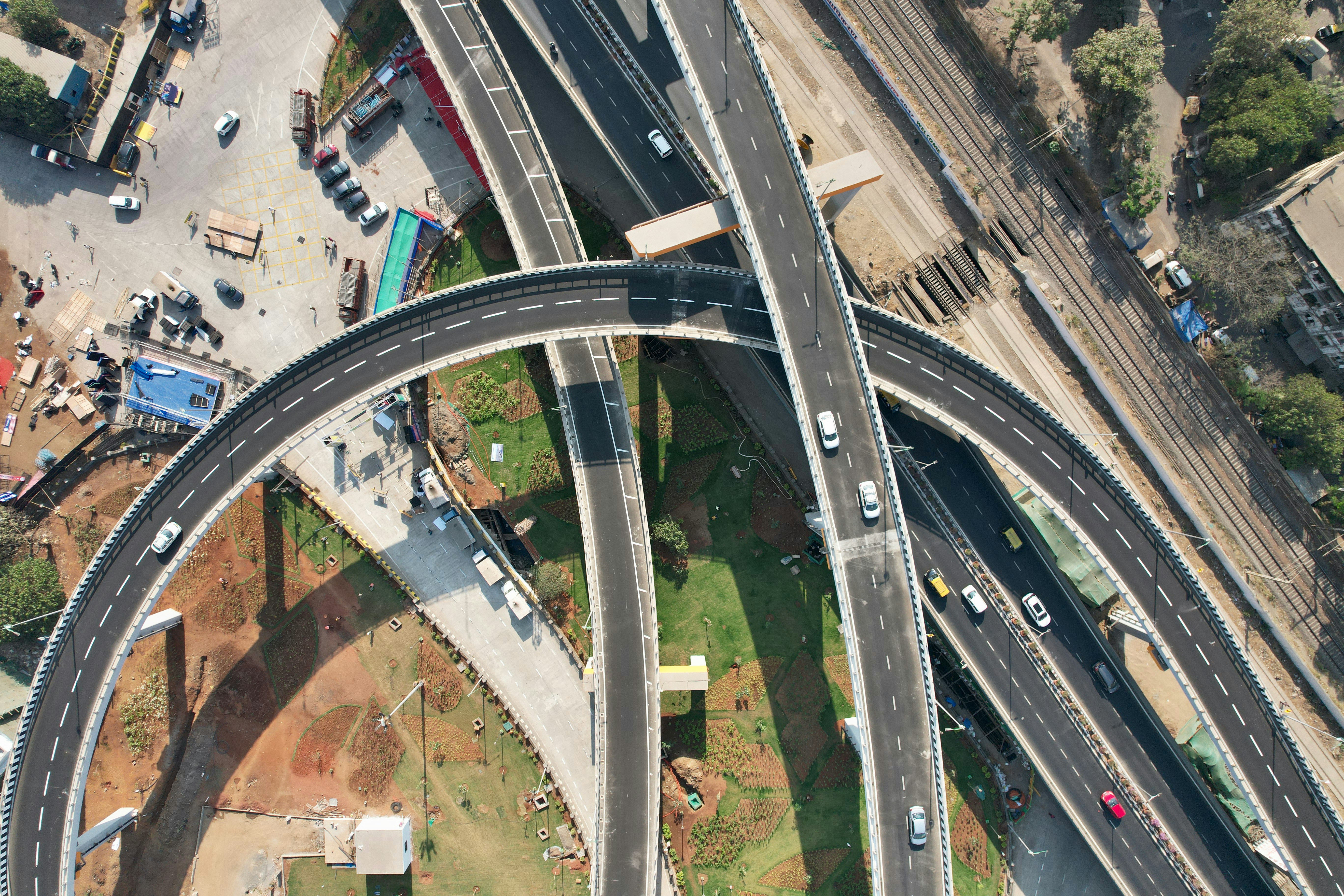 An aerial view of a highway intersection in a city photo – Free India ...