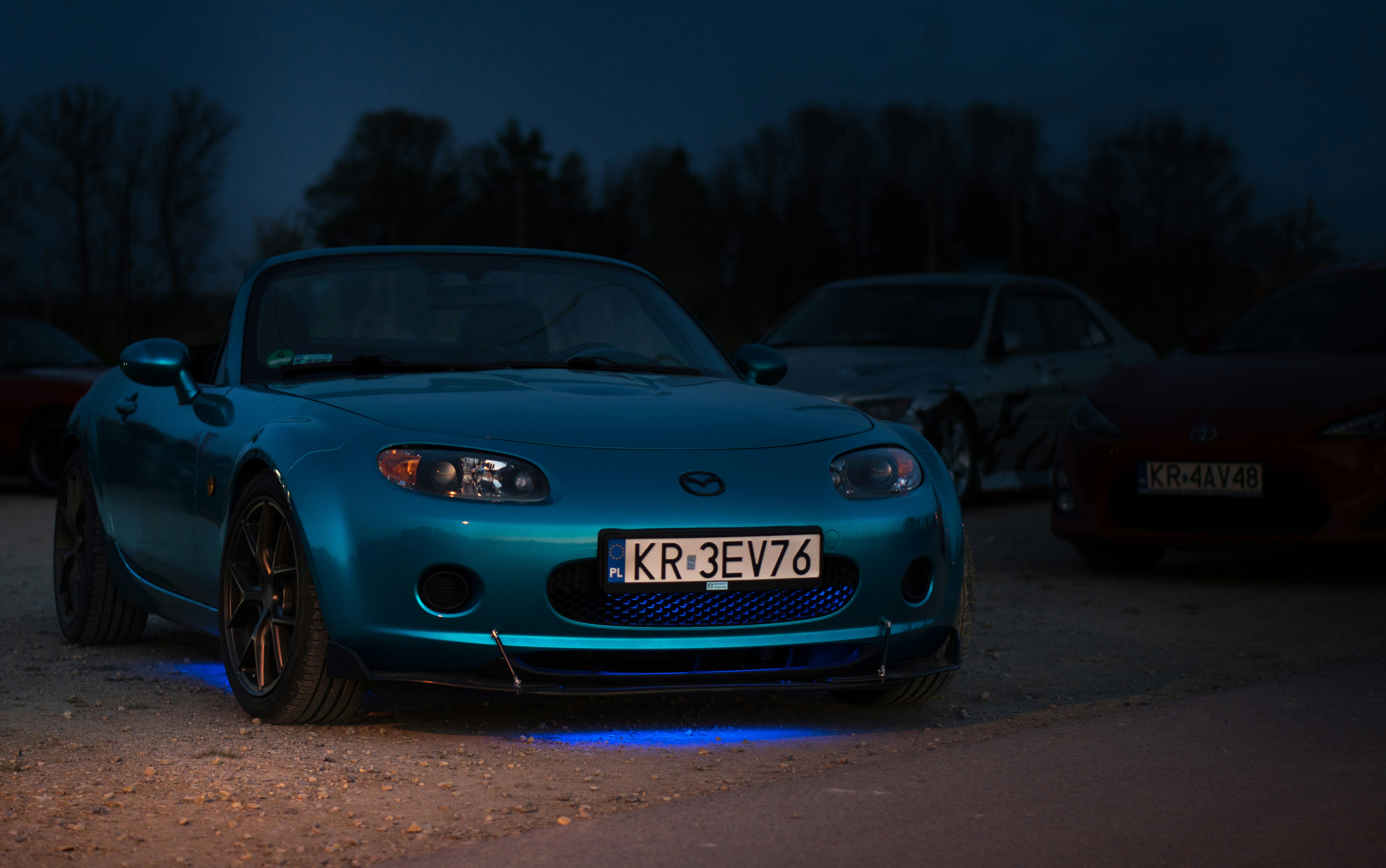 Azure Mirage: Neon underglow Mazda MX-5 at Twilight