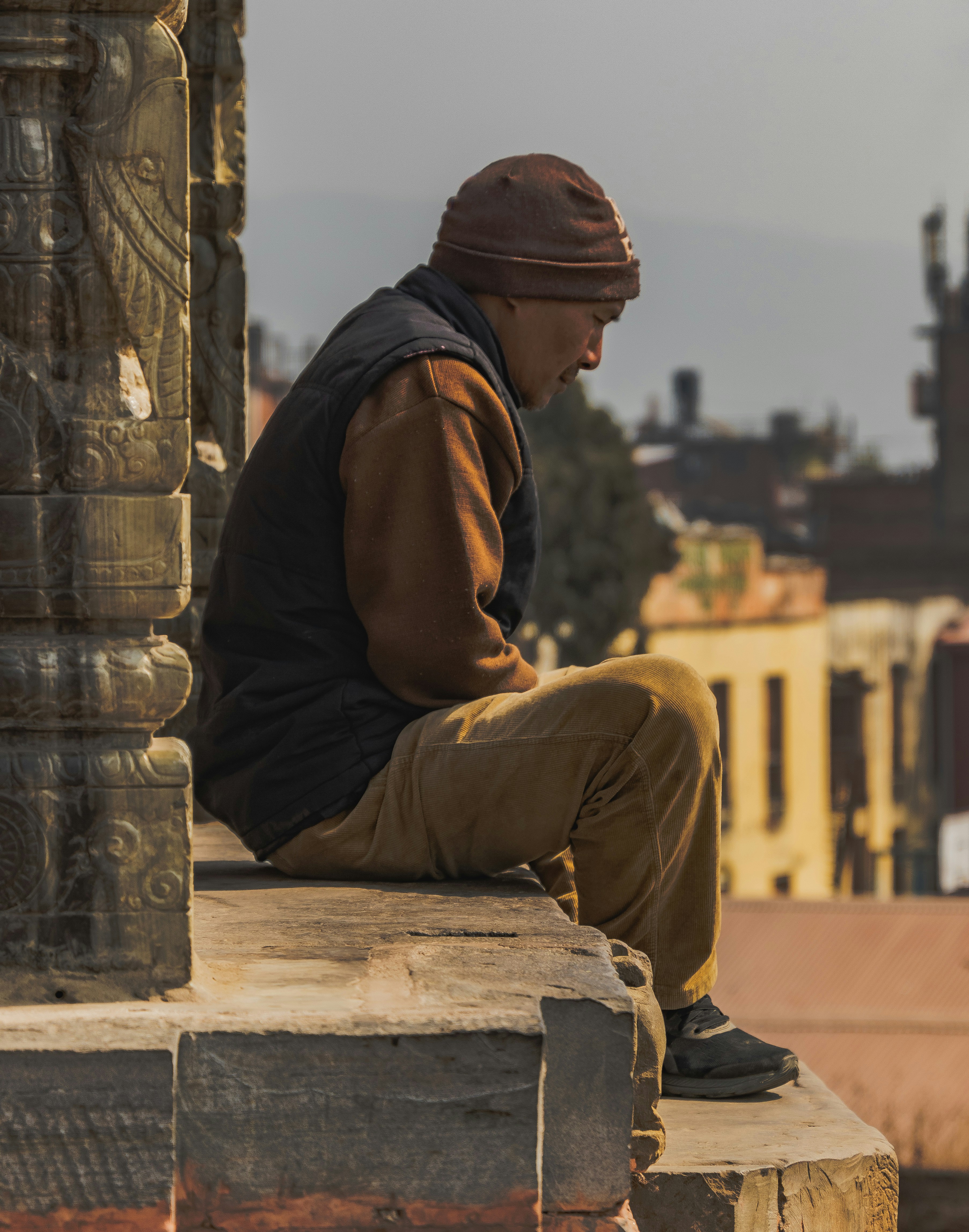 Stone Balcony Solitude: A Quiet Portrait Above the City