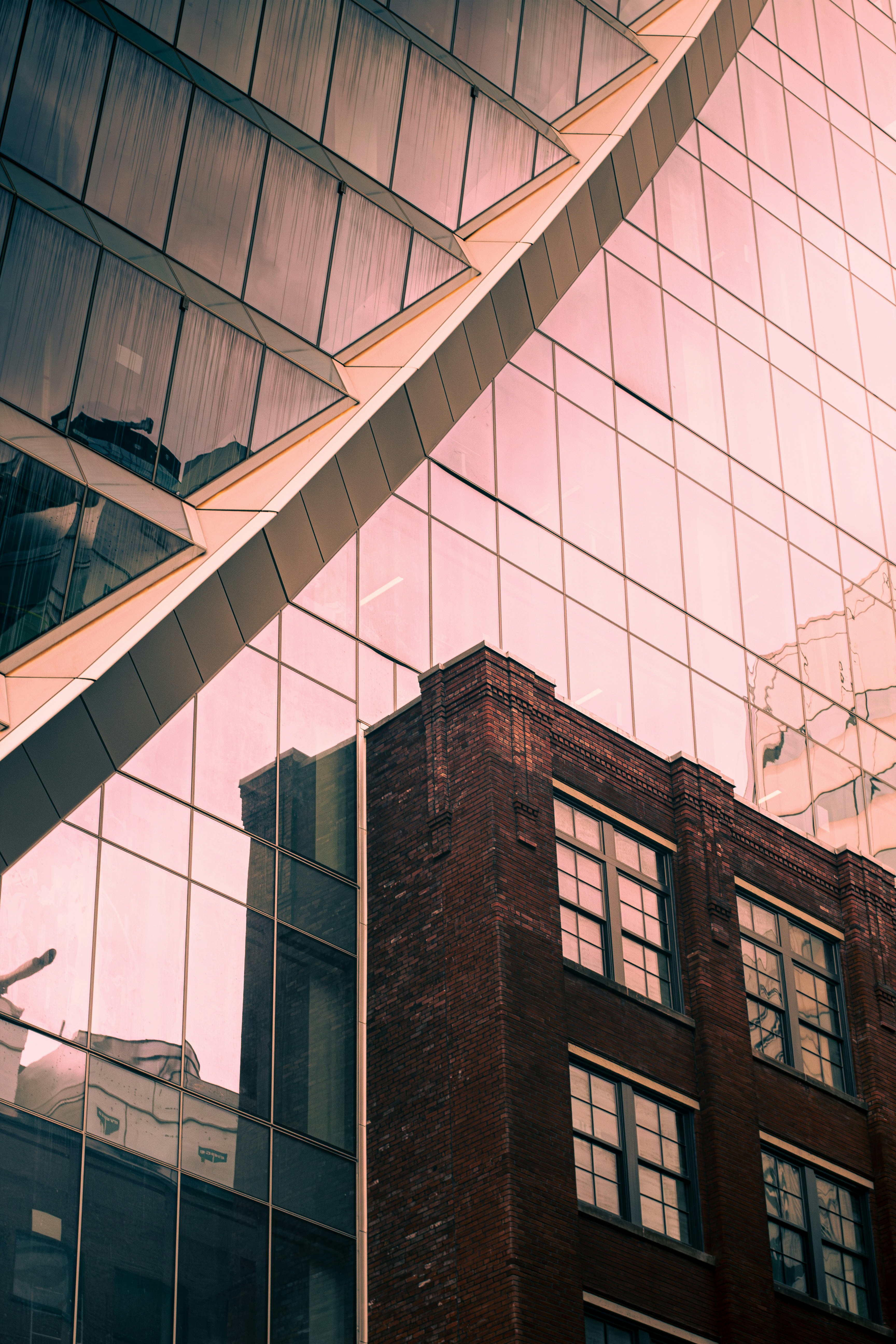 A large building with a very tall building next to it photo – Free ...