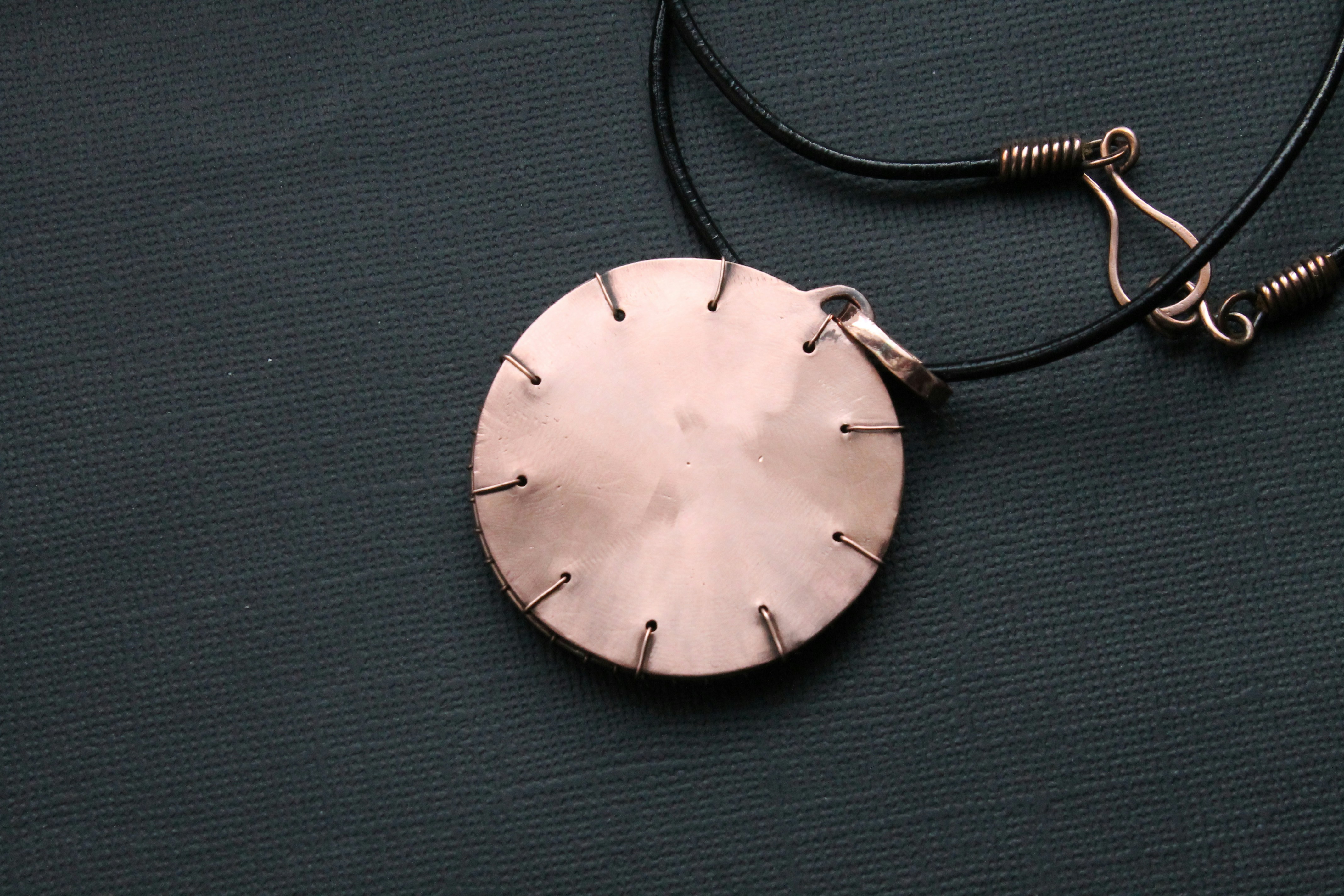 Copper Crescent: Handmade Circle Pendant on Dark Canvas