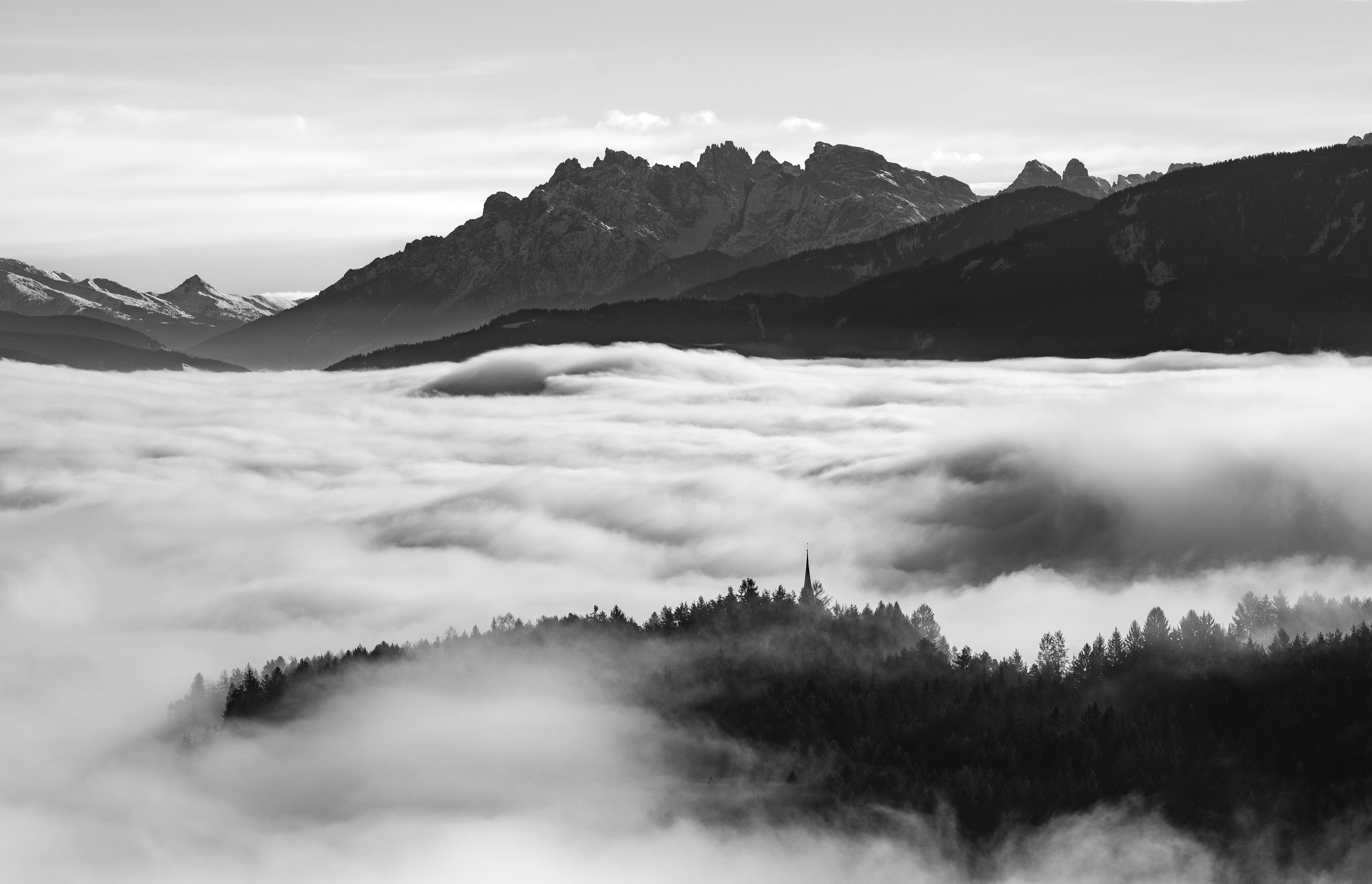 Mist over the Ridge: Mountain Crest Emerges from Cloud Sea
