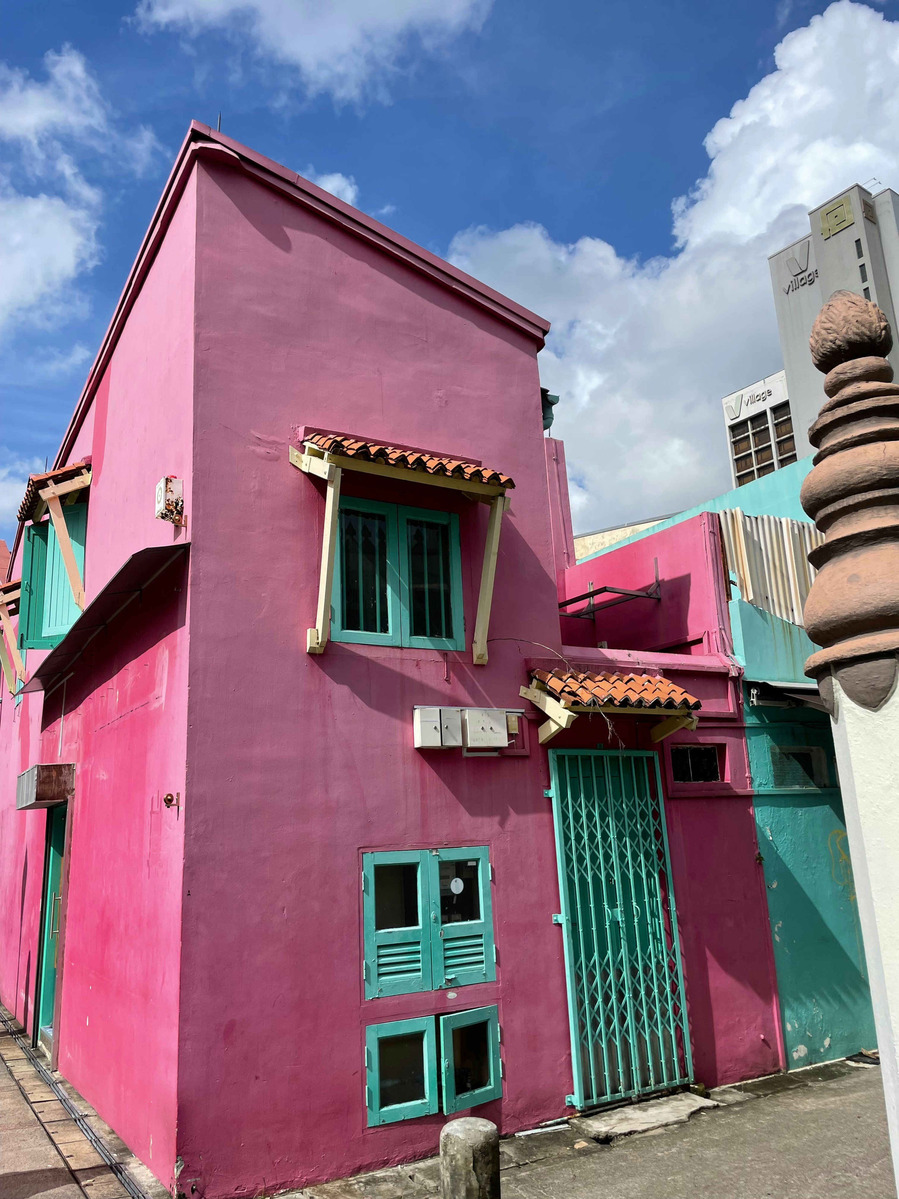 A pink building with green doors and windows photo – Free Grey Image on ...