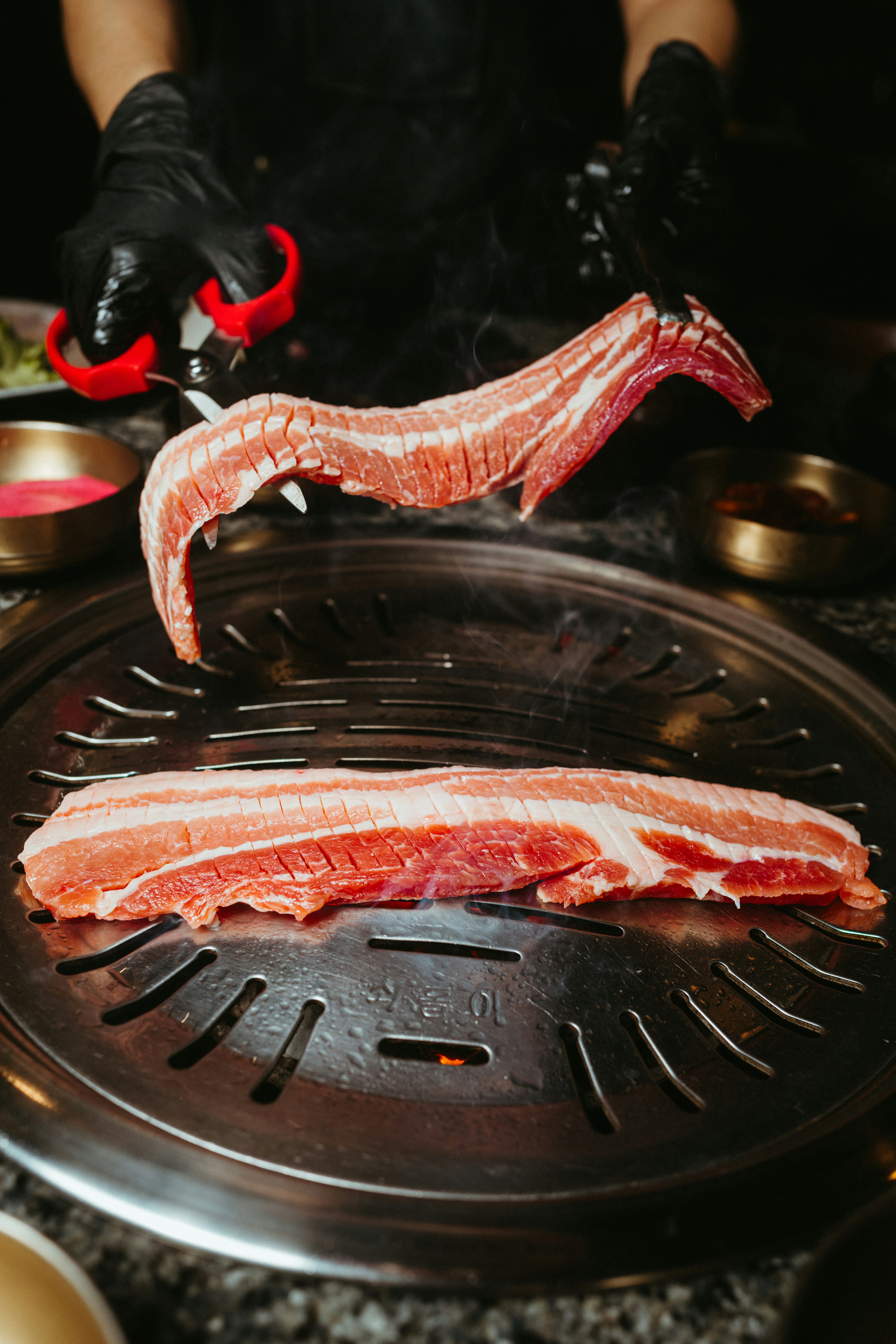 Wagyu Ribbons Sizzle on a Circular Grill: A Teppanyaki Moment