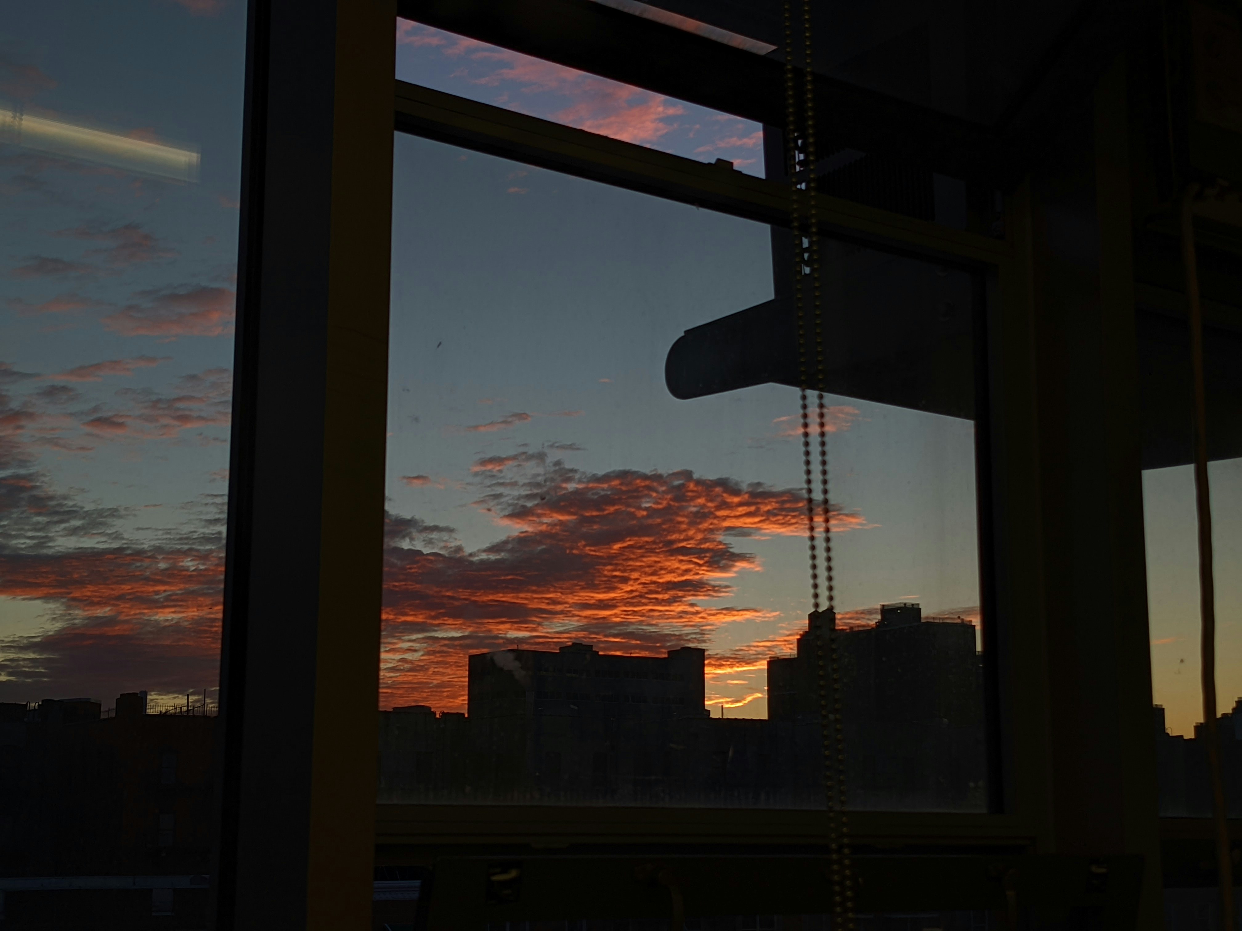 A view of a sunset through a window photo – Free South bronx Image on ...