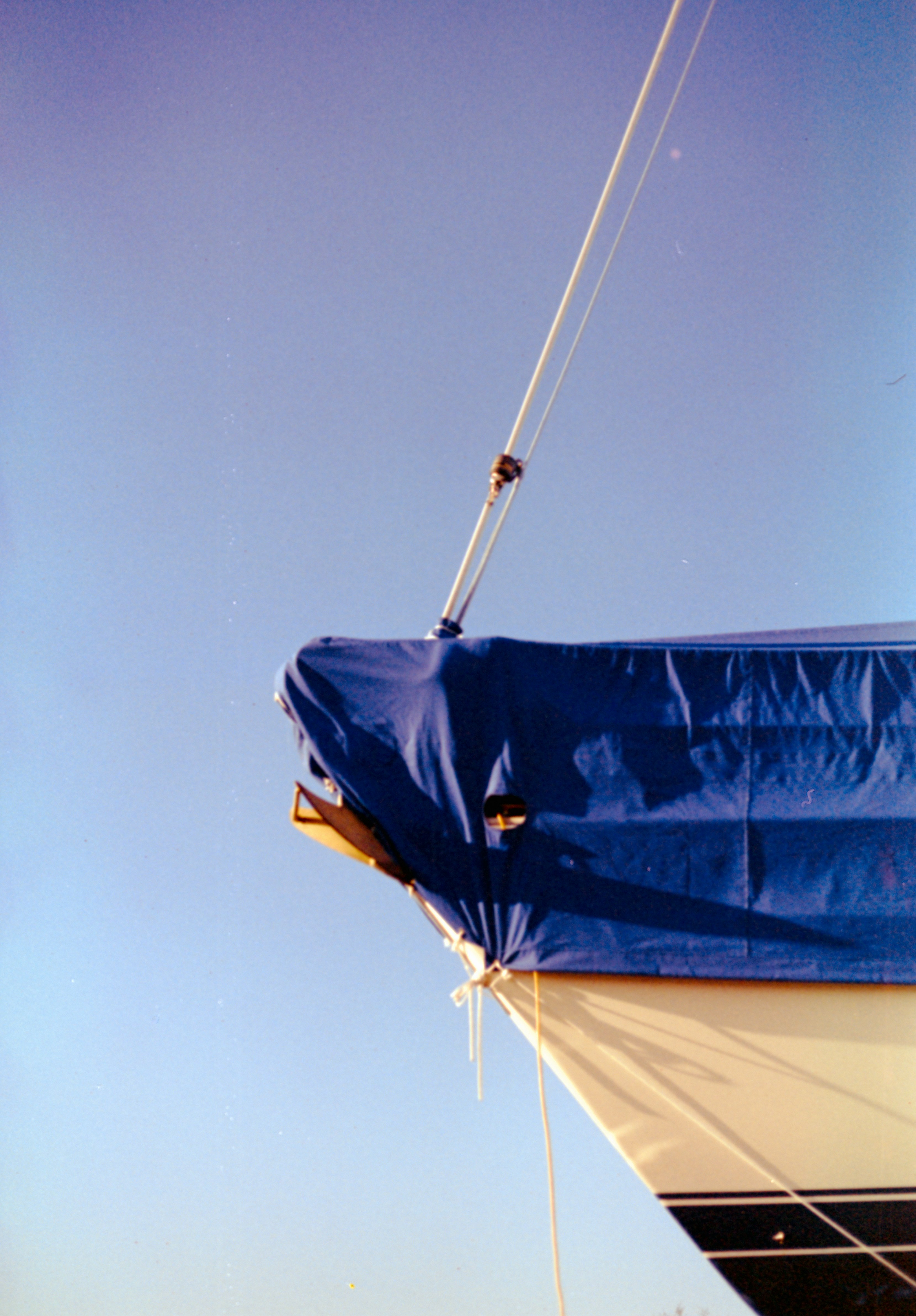 A sail boat with a blue tarp on top of it photo – Free Sunny day Image ...