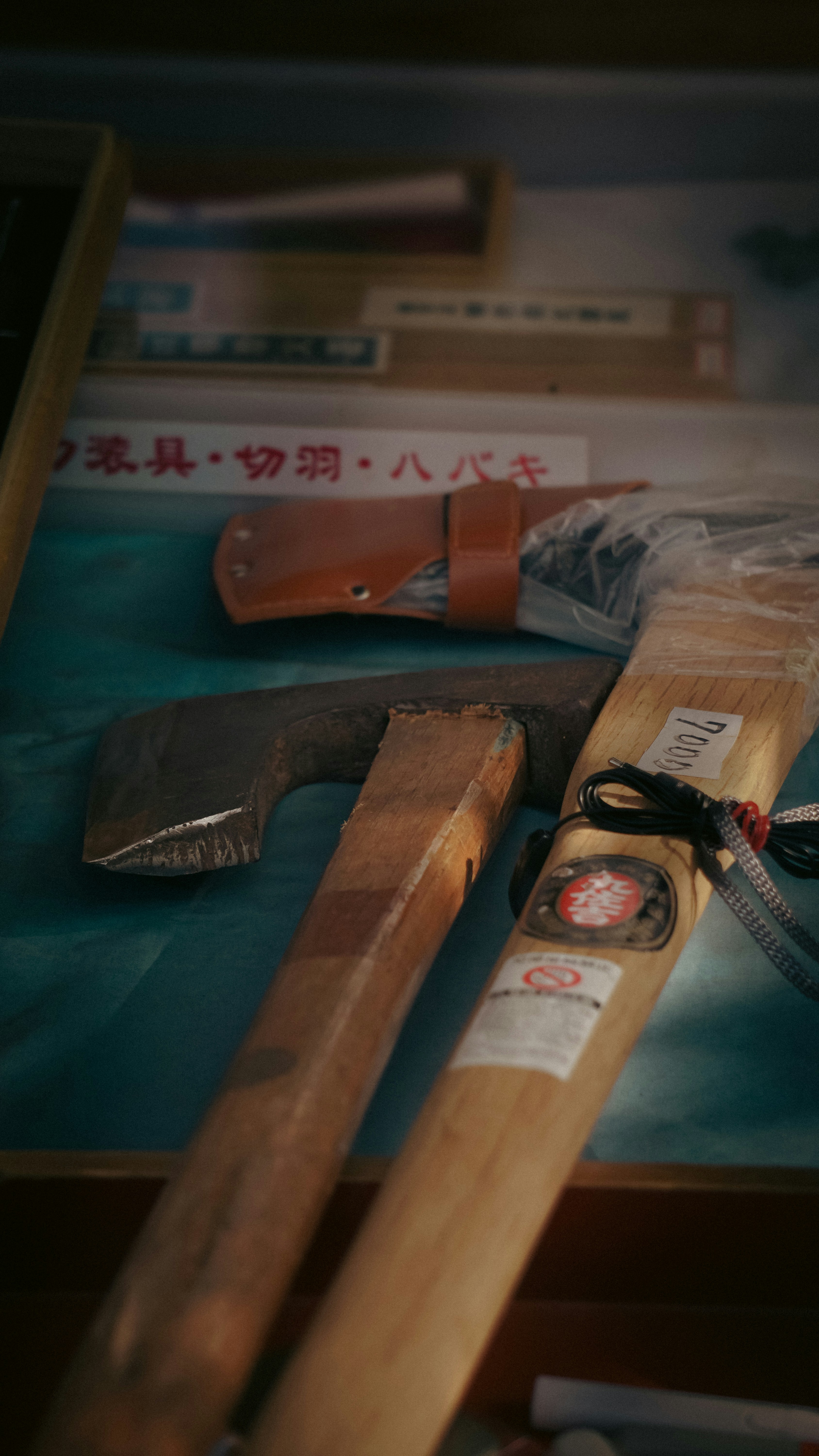 Hammer and Axe in a Quiet Tools Display under Soft Lighting