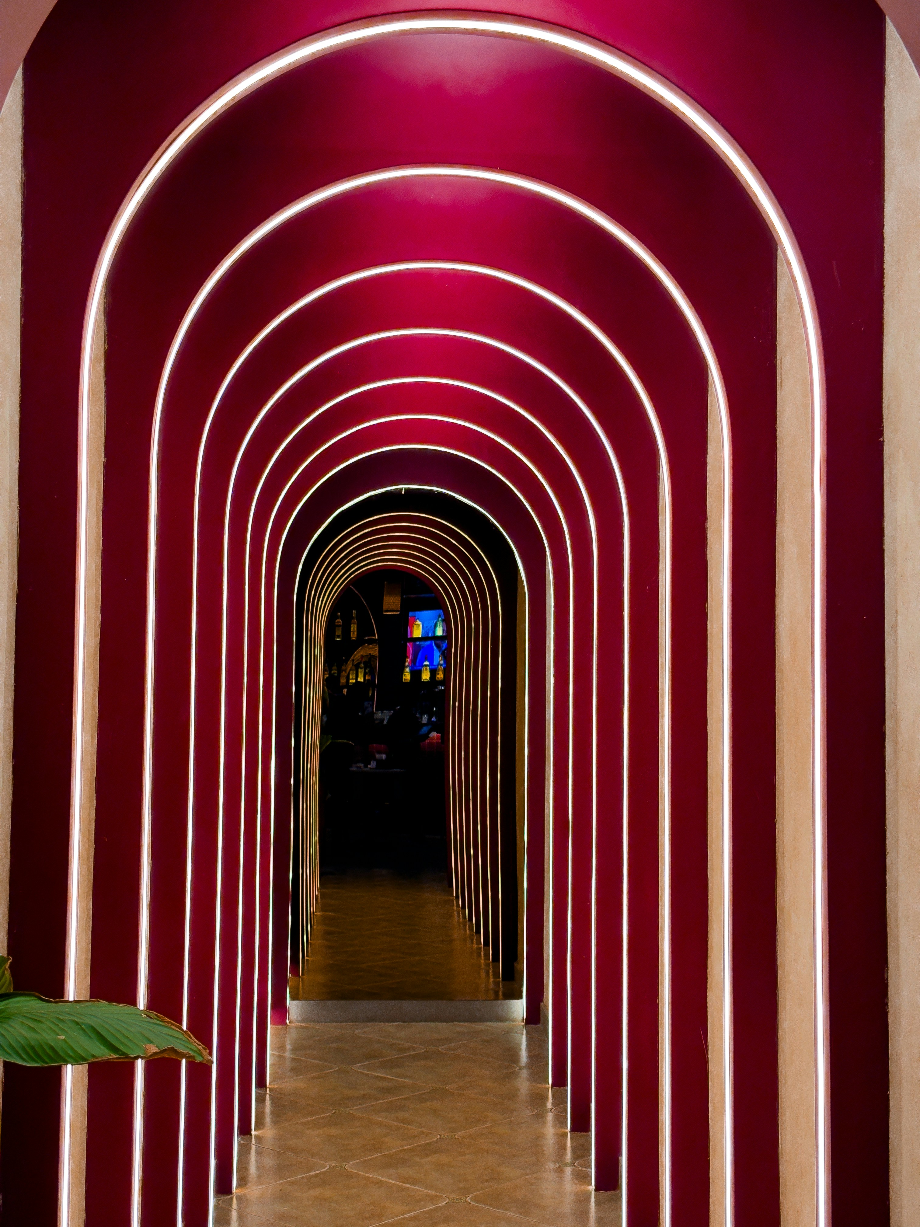 Neon Archway Corridor: Repetition Draws the Eye into the Tunnel