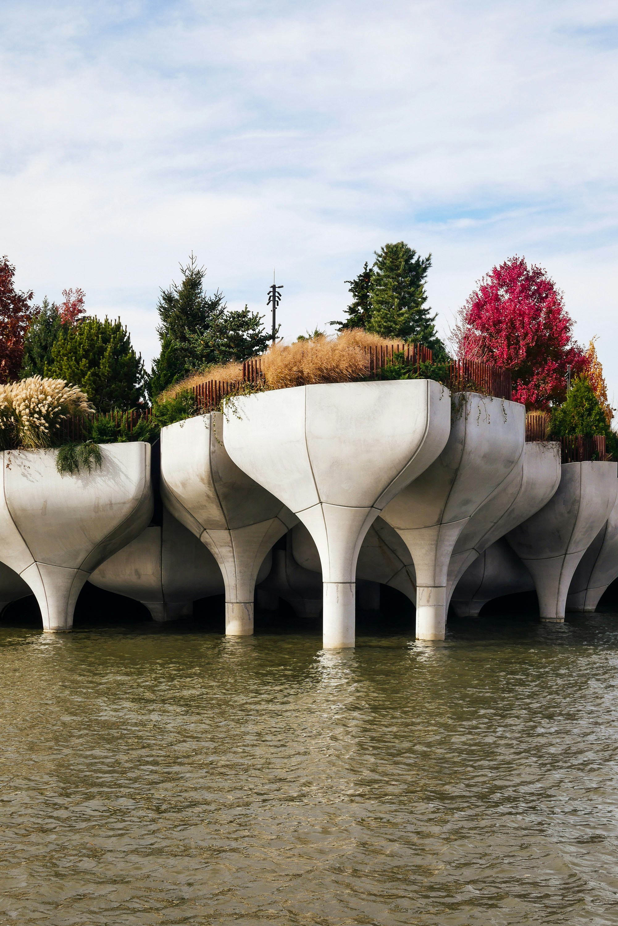 Riverfront Garden Arches: Planter-Top Columns Rising from the Water