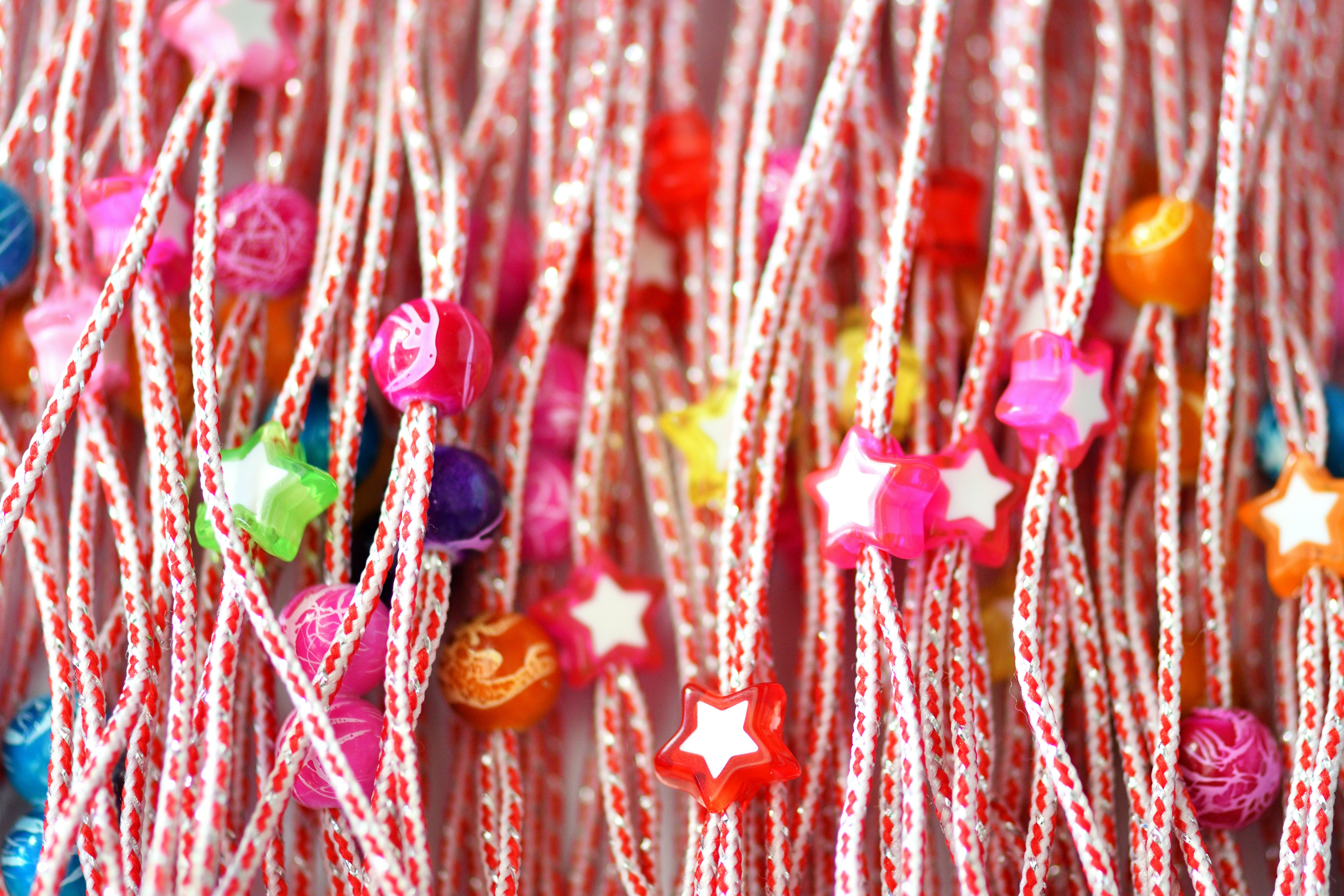 Starry Strings: A Macro Portrait of Colorful Bead Threads