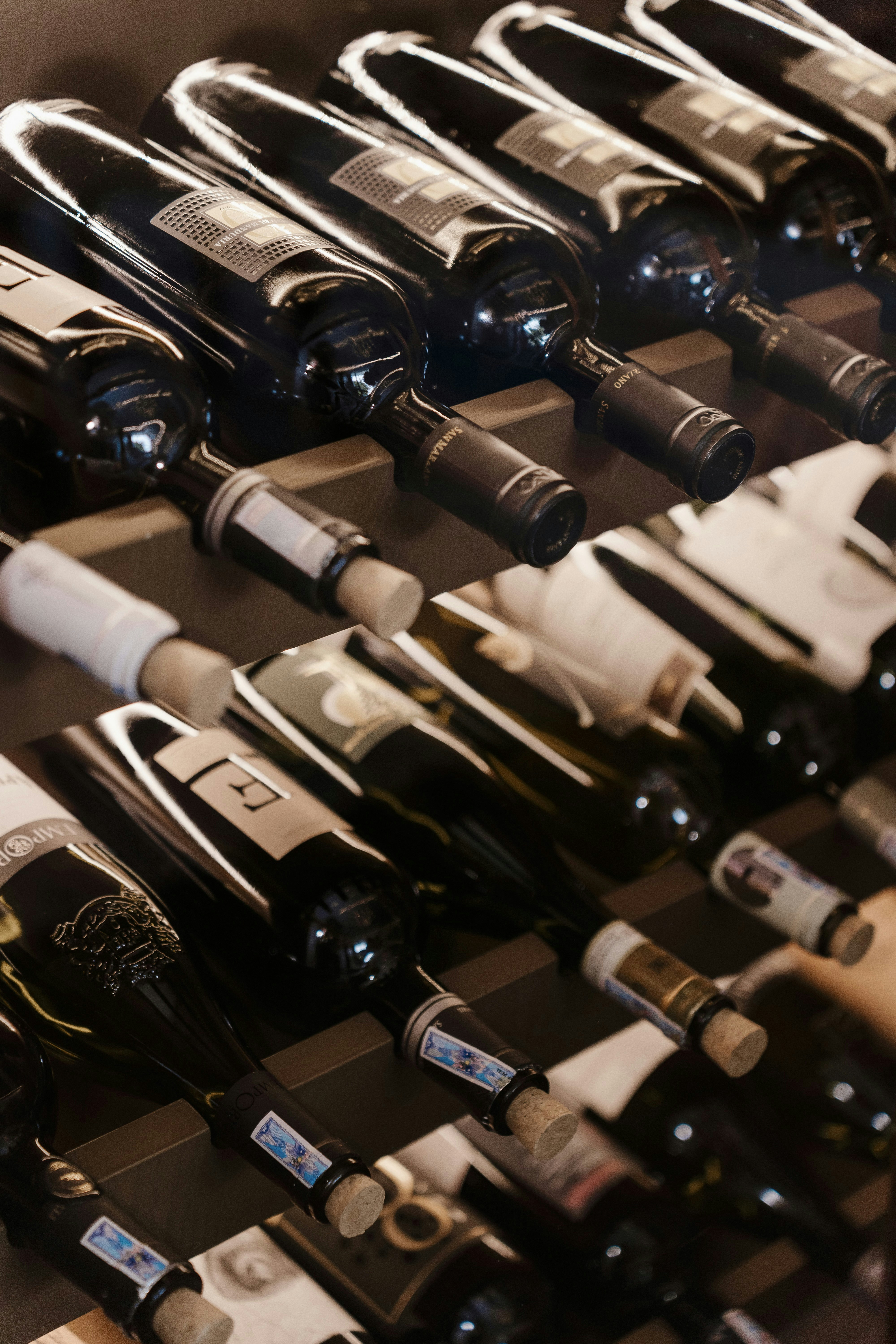 A bunch of bottles of wine are lined up photo – Free Alcohol Image on ...