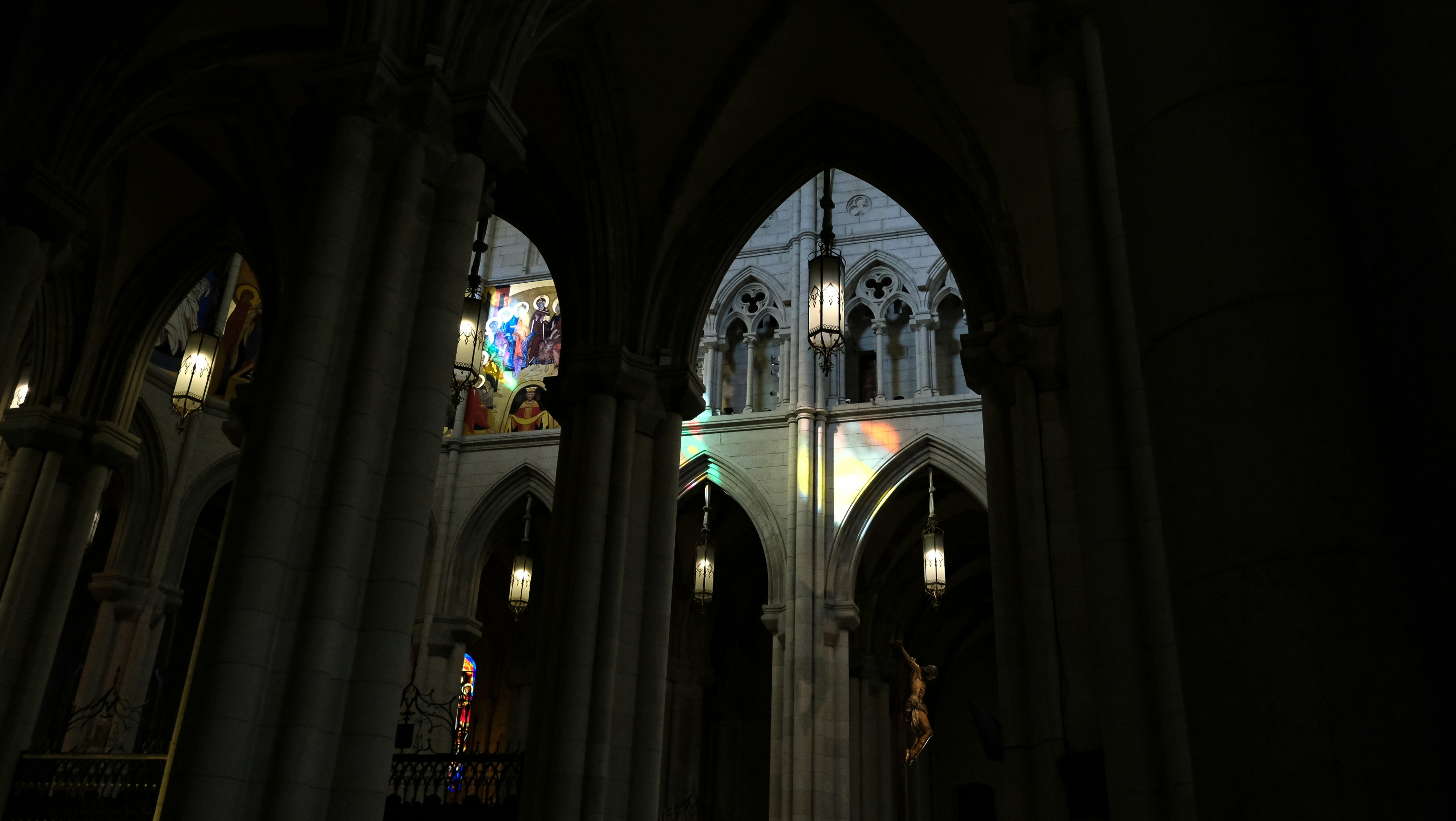 A cathedral with stained glass windows at night photo – Free Church ...
