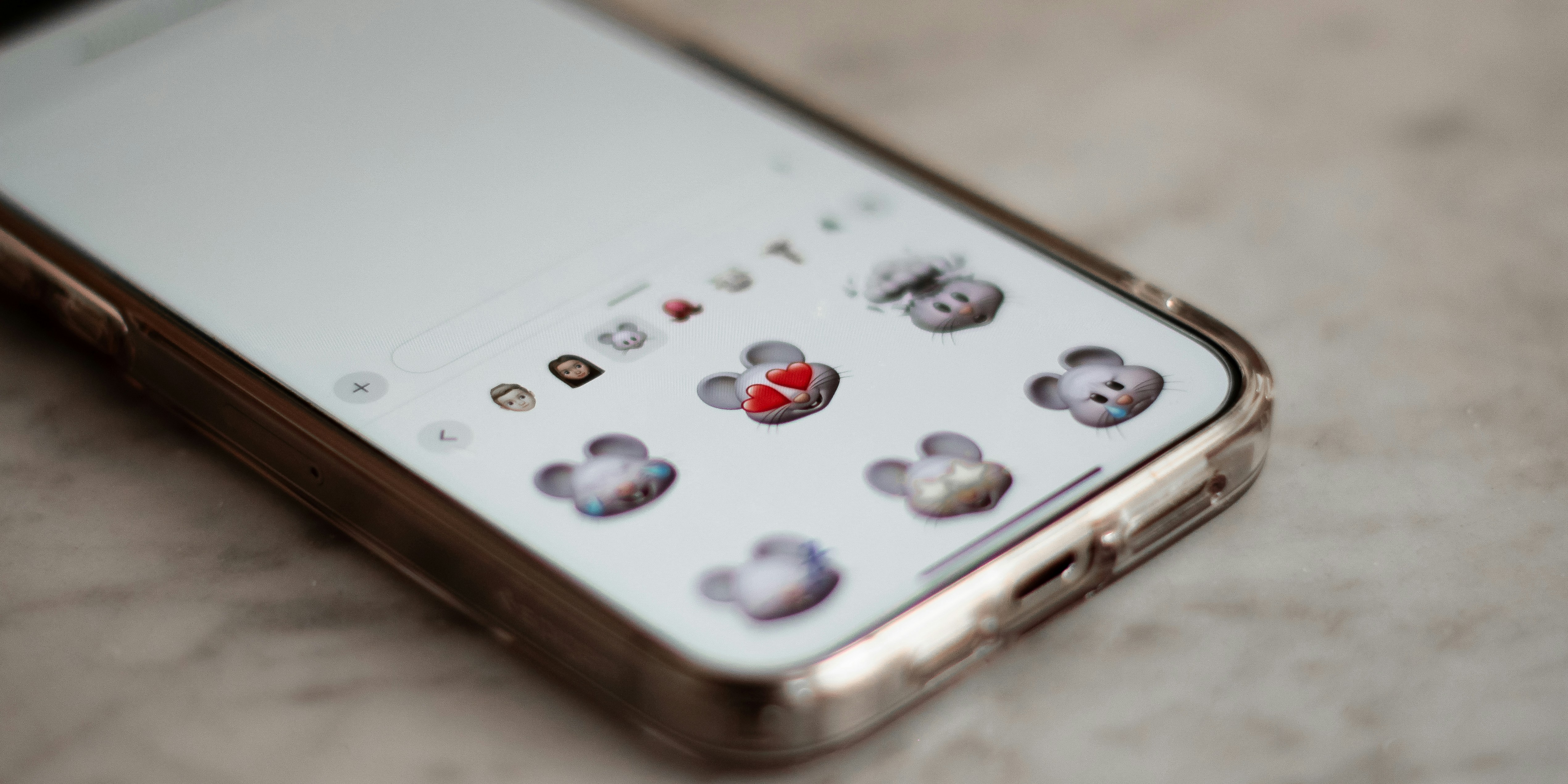 Heart Emoji Spotlight on a Marble Desk Smartphone Screen