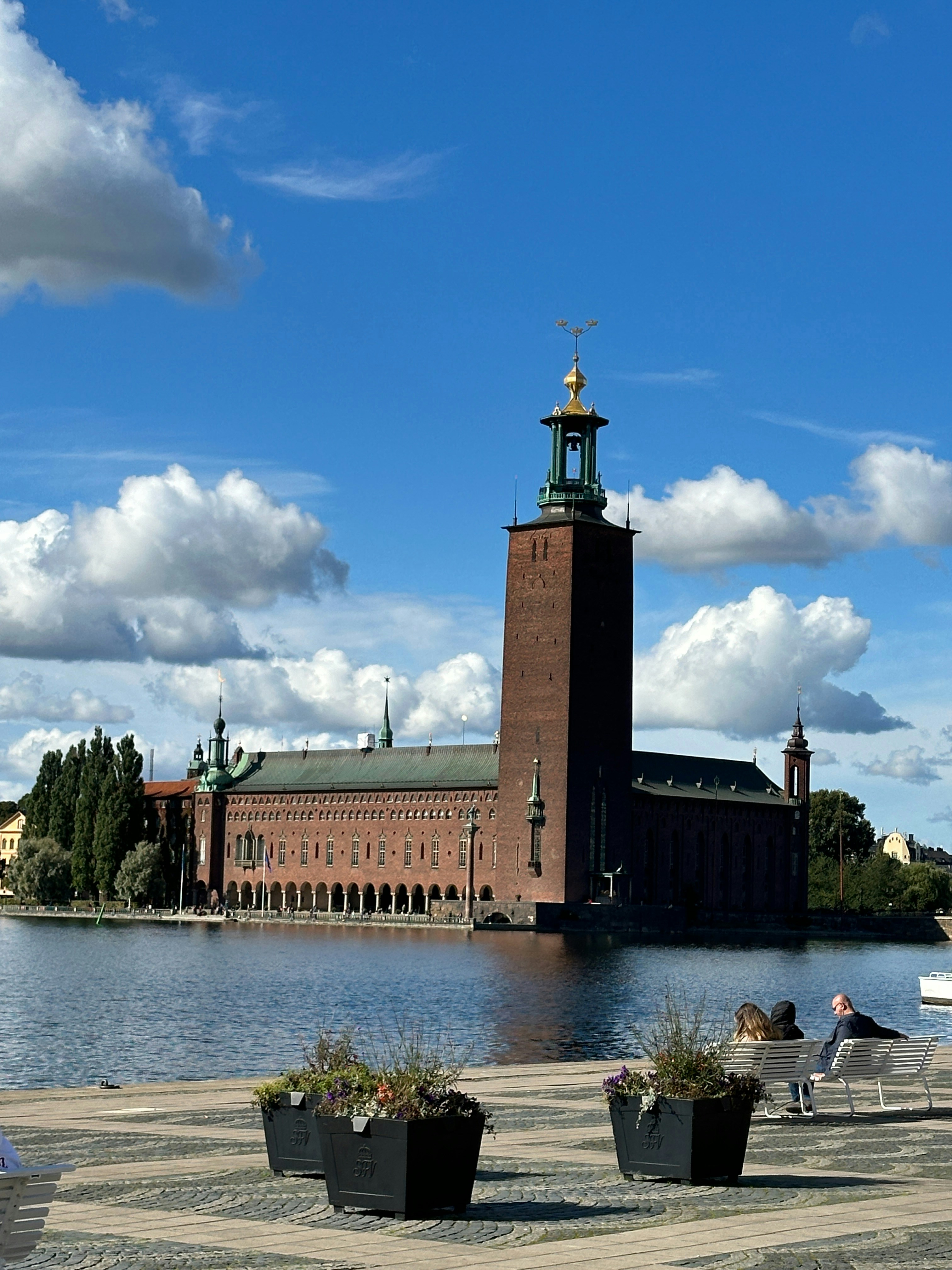 Brick Tower Over the Calm Waterfront: A Riverside Beacon