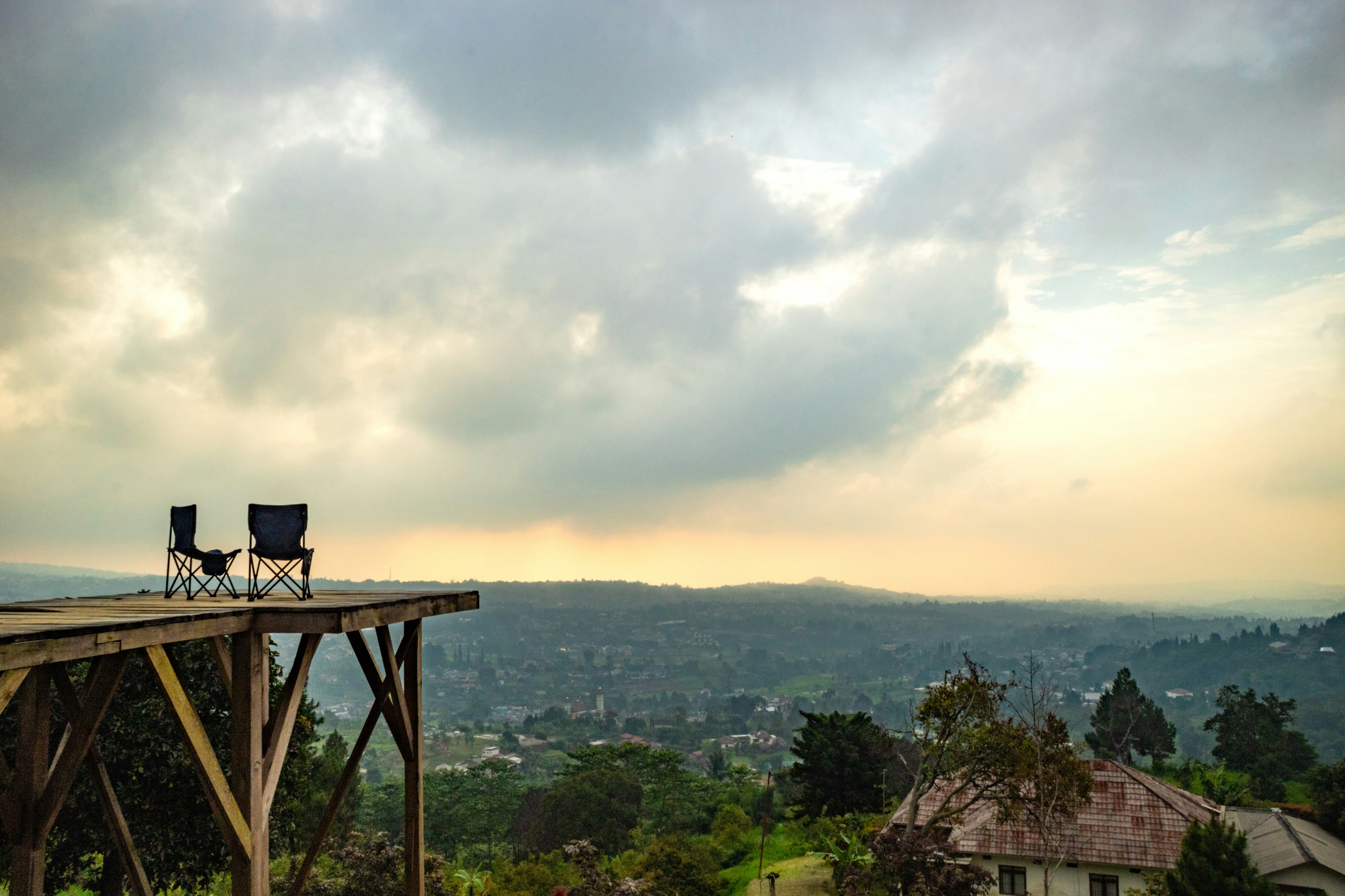 Deckside Vista: Chairs Overlooking a Valley Sunrise
