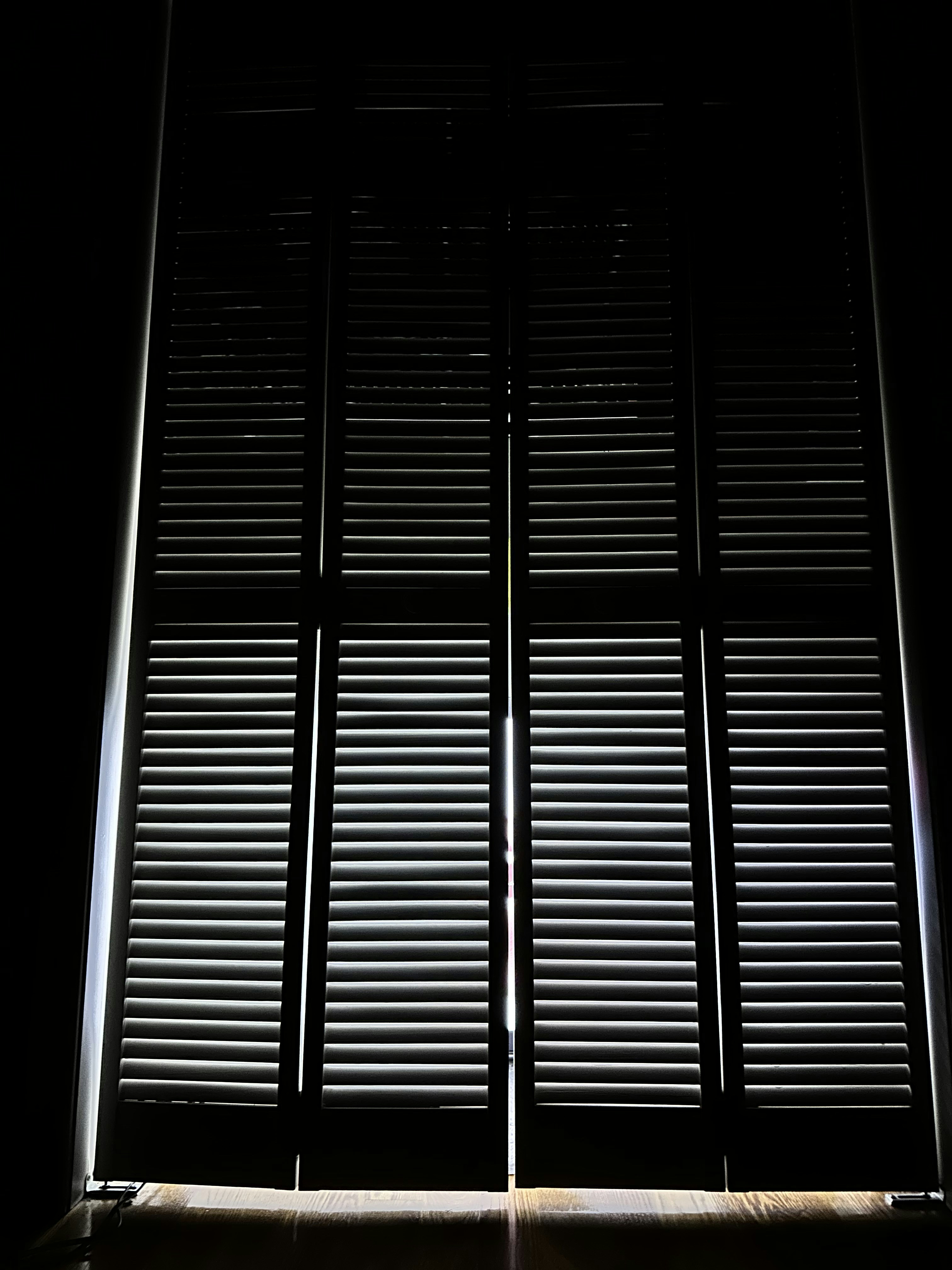 A dark room with a window and a light coming through it photo – Free ...