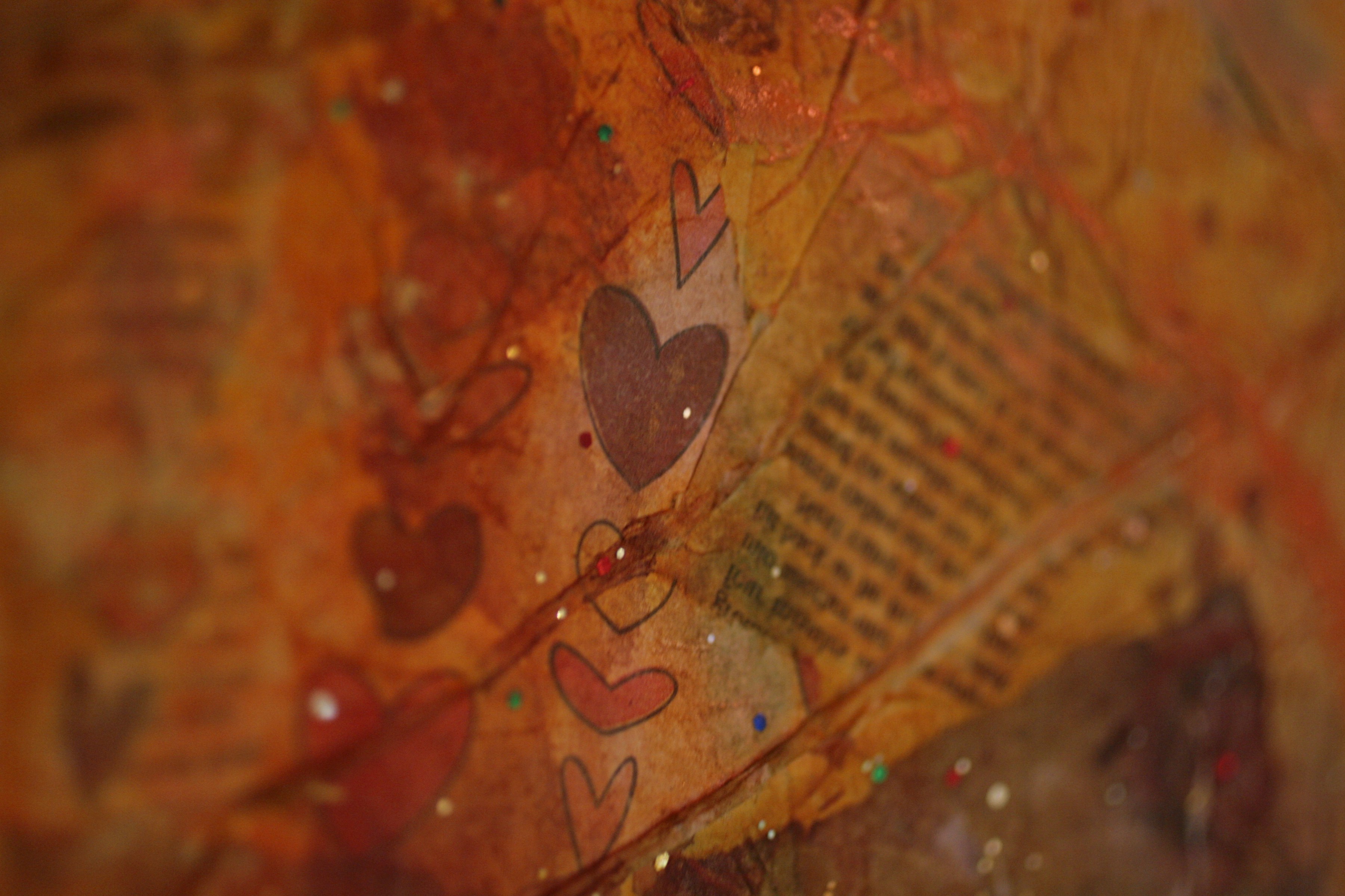 Amber Hearts on a Glittered Page: A Macro Study of Texture and Warmth