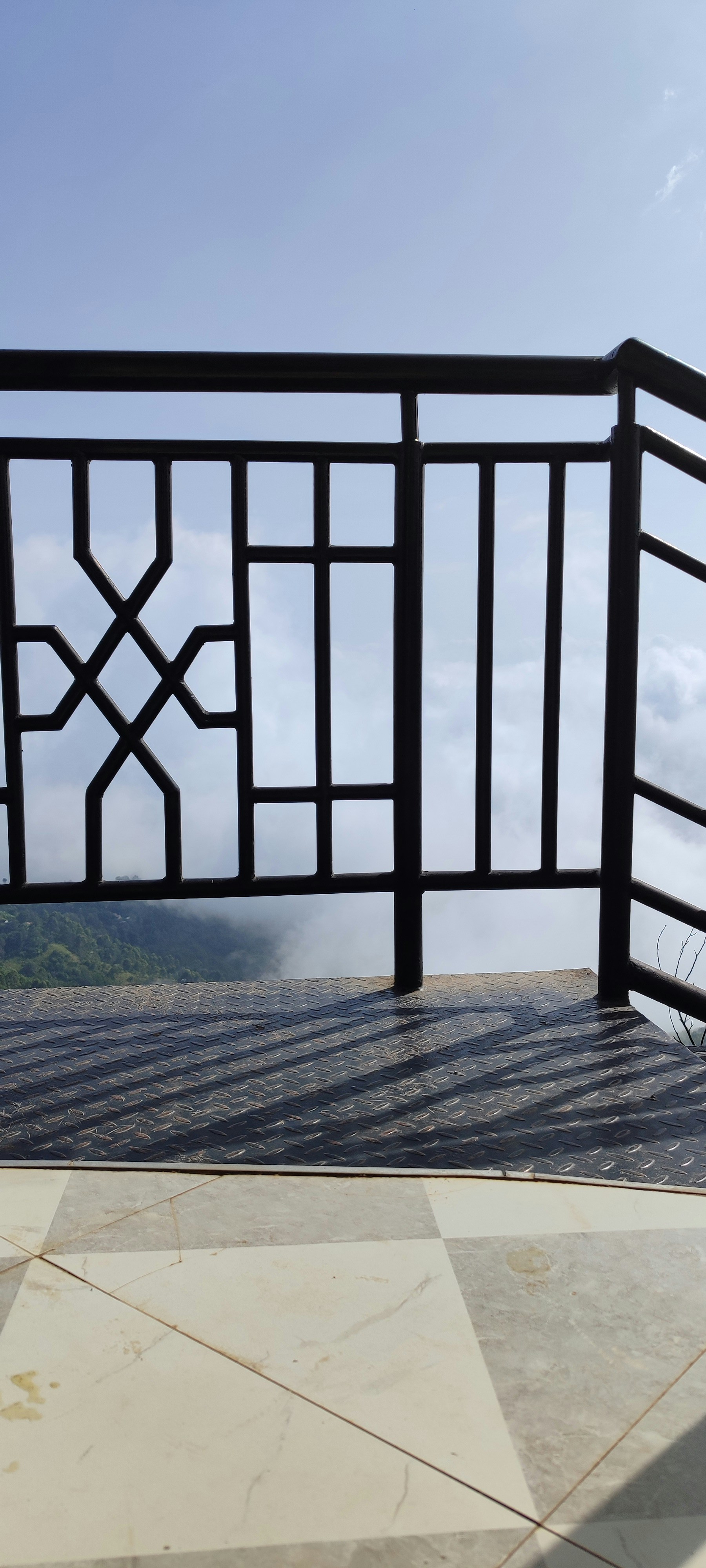 a skateboarder is doing a trick on a railing