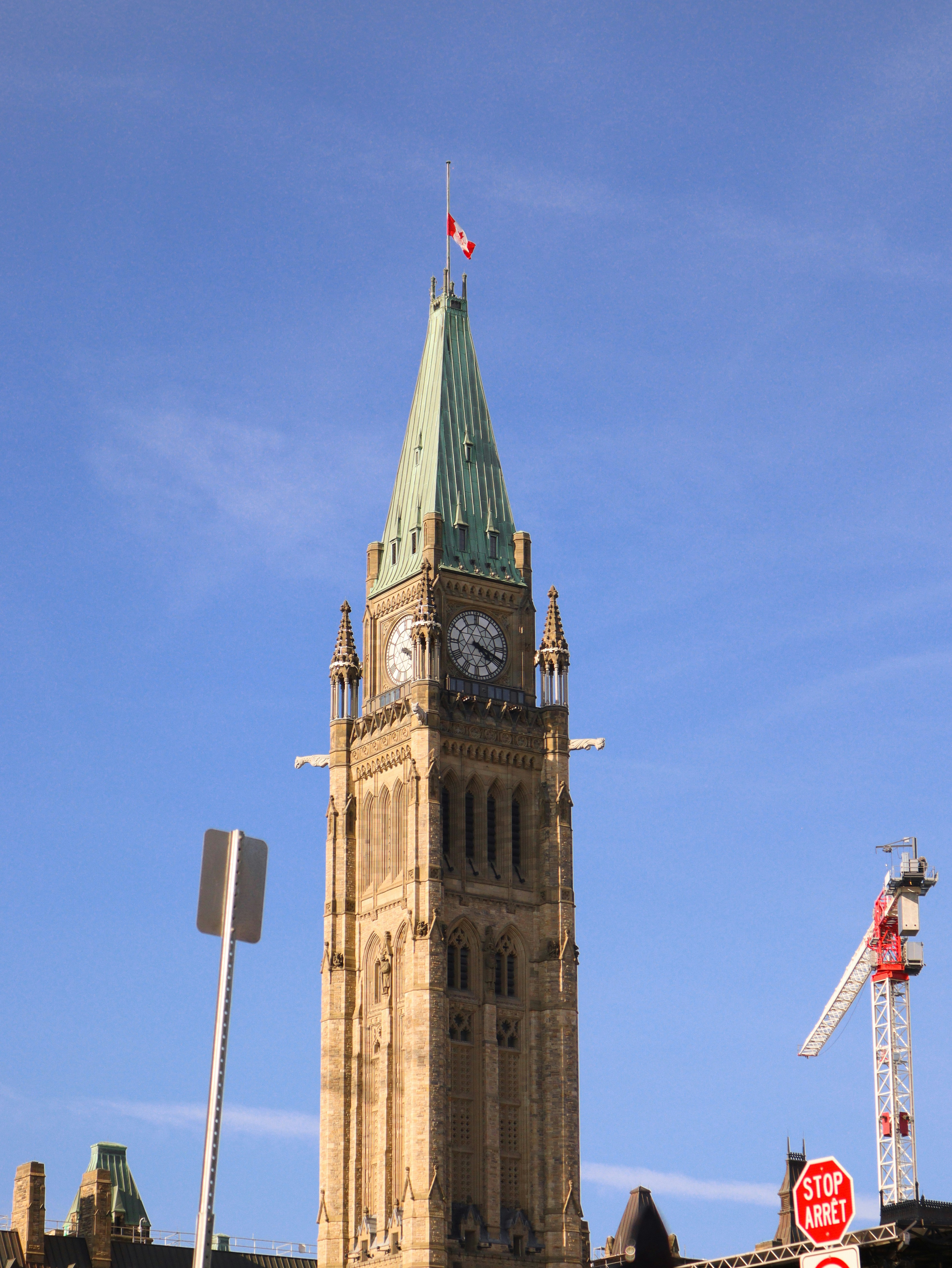 A tall clock tower with a clock on each of it's sides photo – Free ...