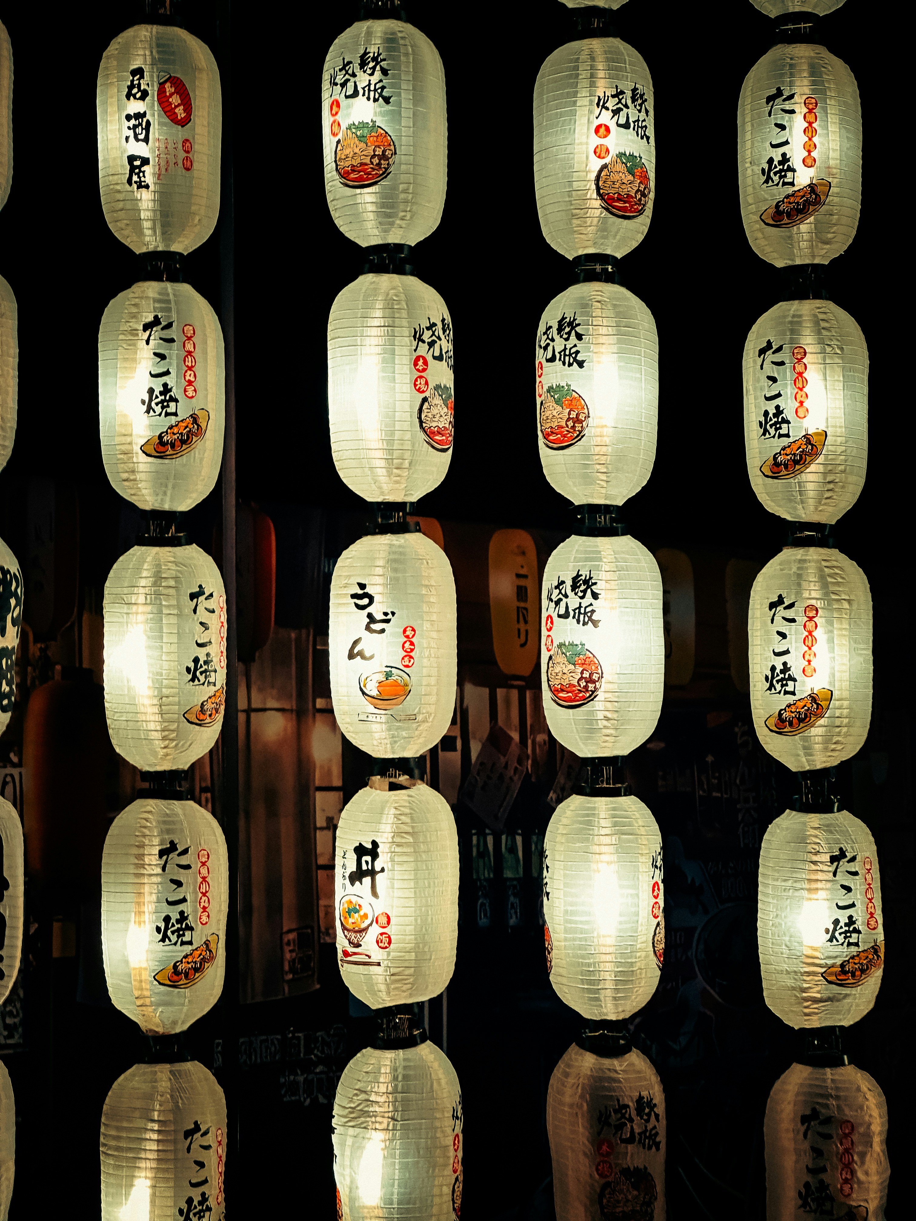 A group of paper lanterns with asian writing on them photo – Free Night ...