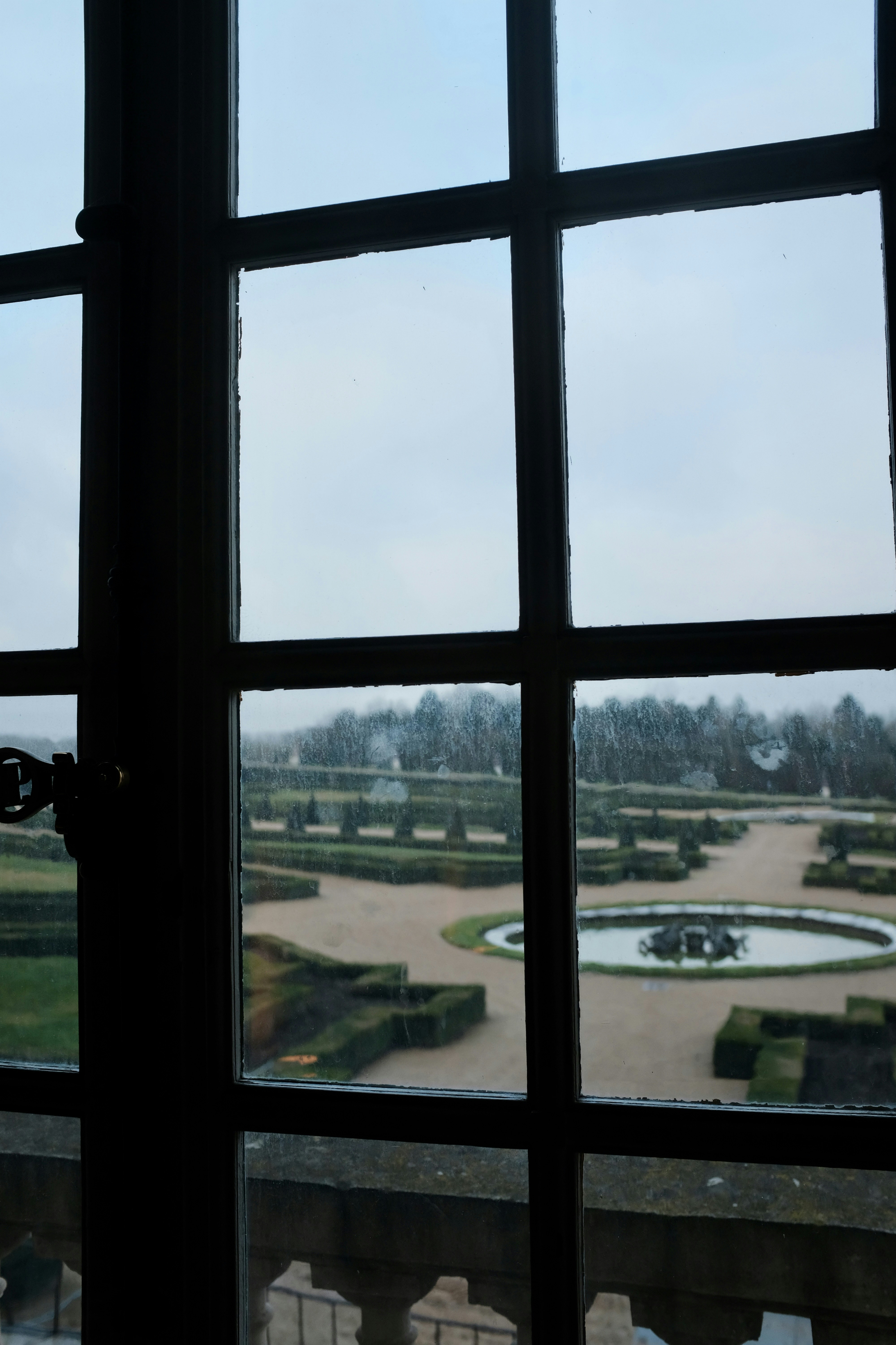 A view out a window of a large garden photo – Free フランス Image on Unsplash