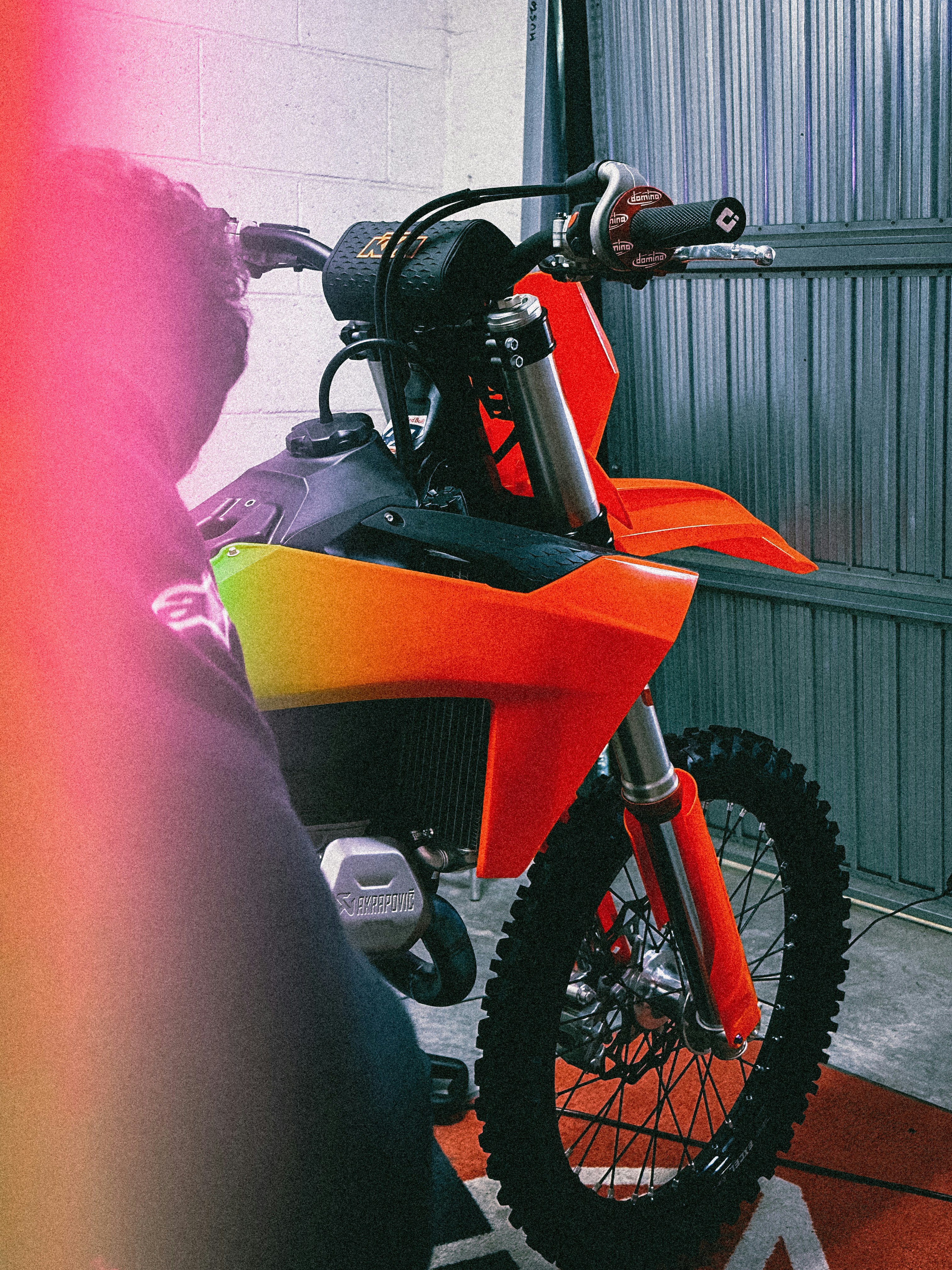 Crimson Dirt Bike in a Quiet Garage: Neon Glow on the Left