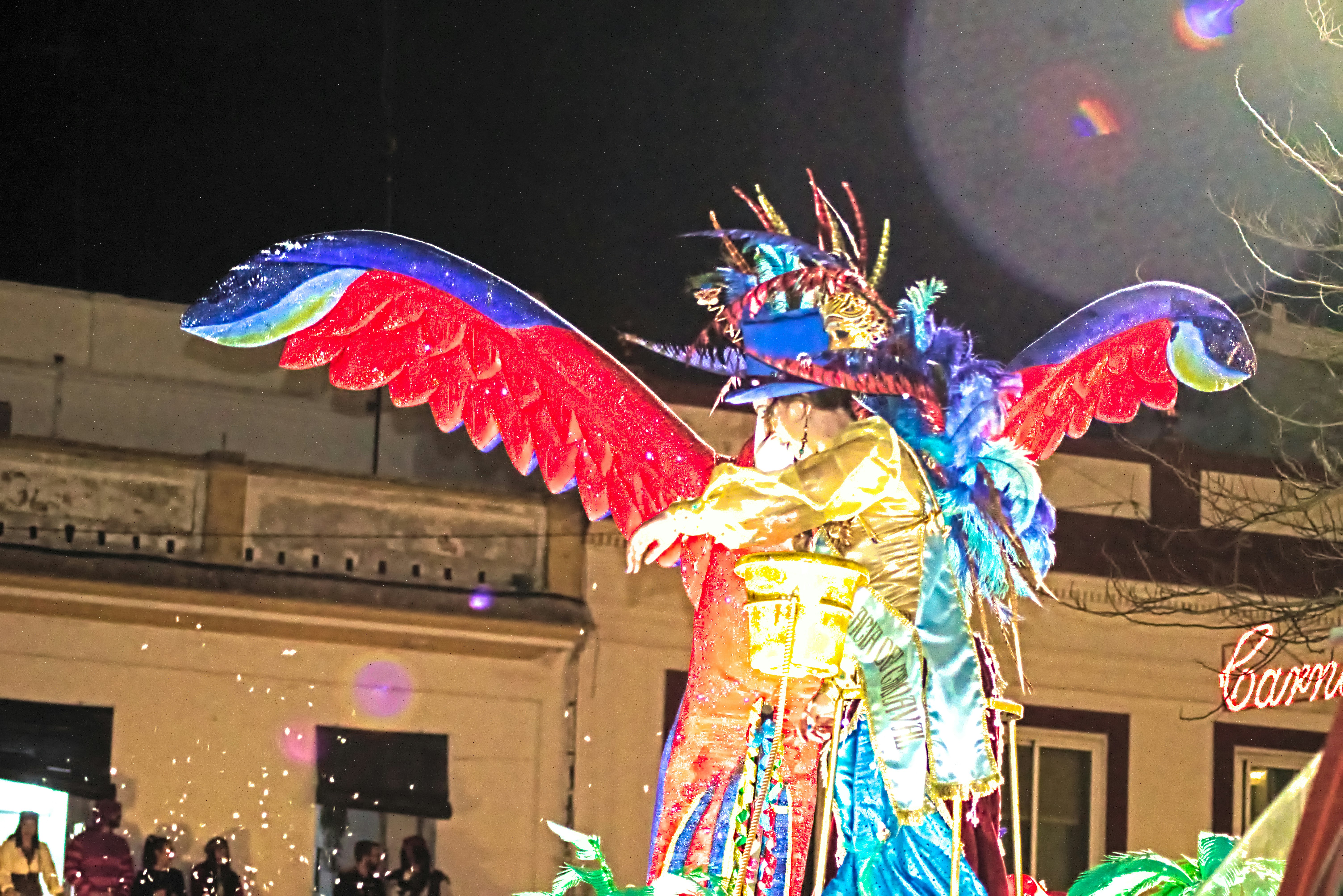 A parade float with a large colorful bird on top of it photo – Free ...