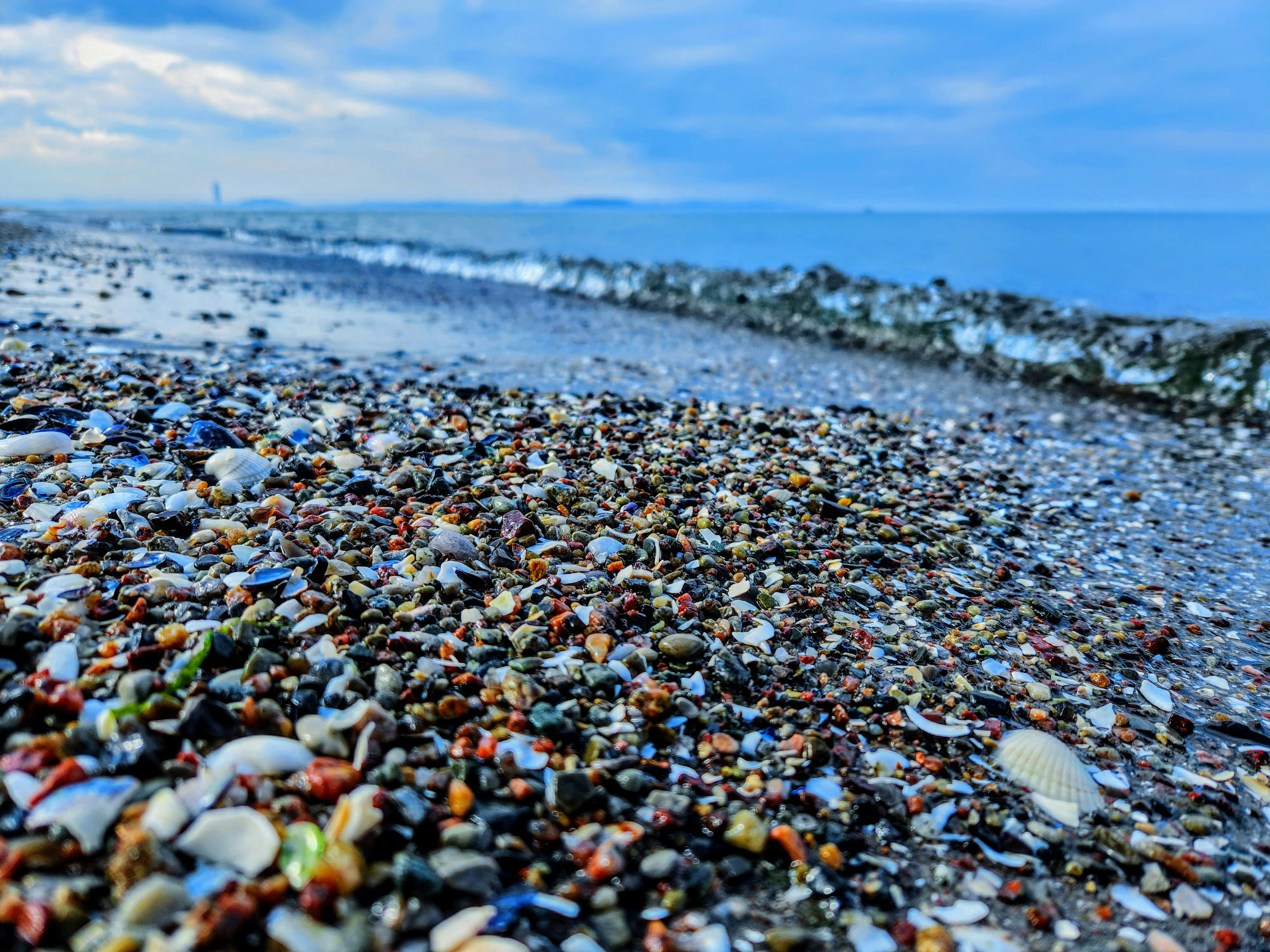 Pebble Mosaic: Shoreline Bound by Pebbles and Foam