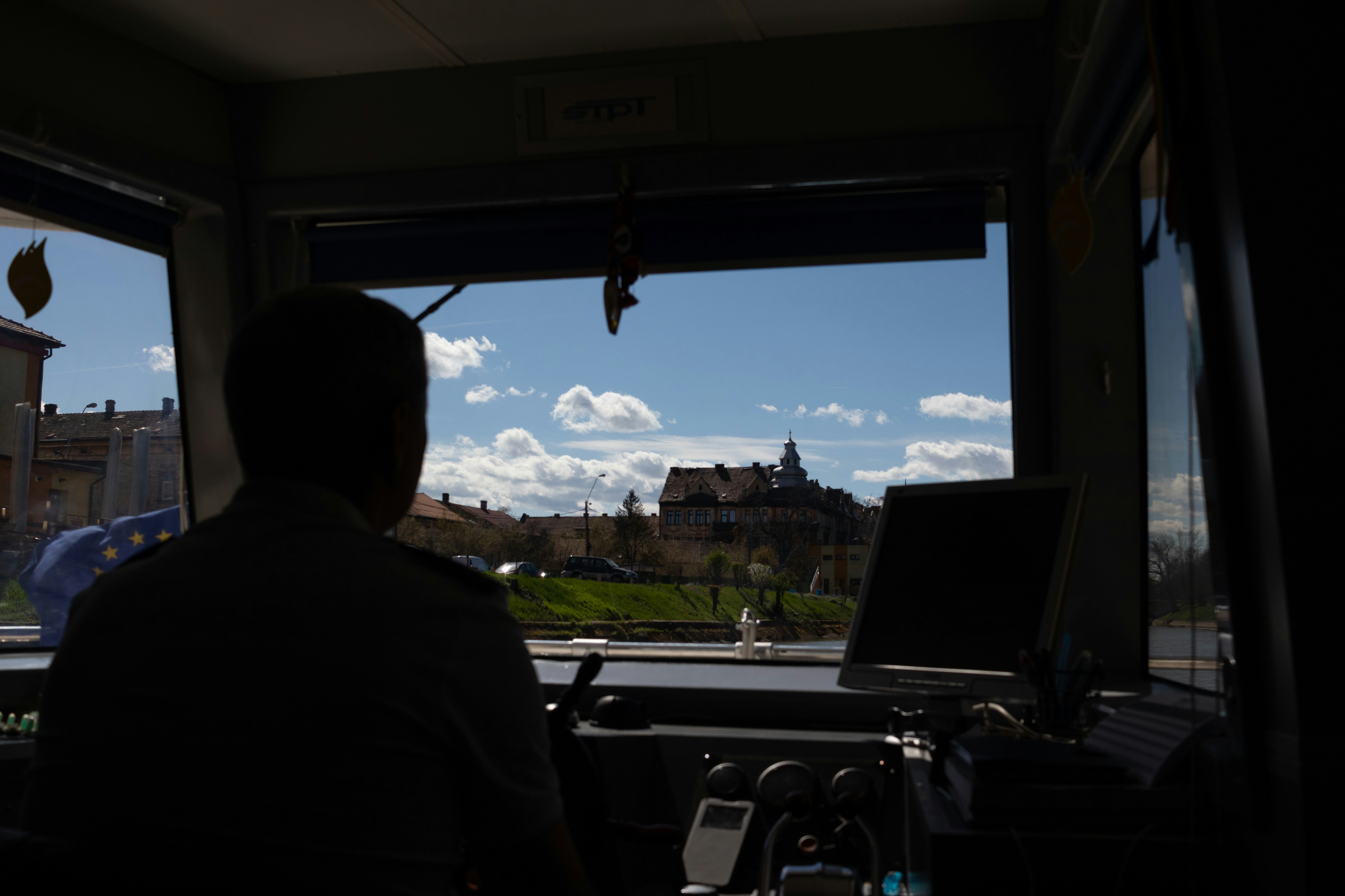 Window to a Quiet City: A Cab View Framed by Darkness