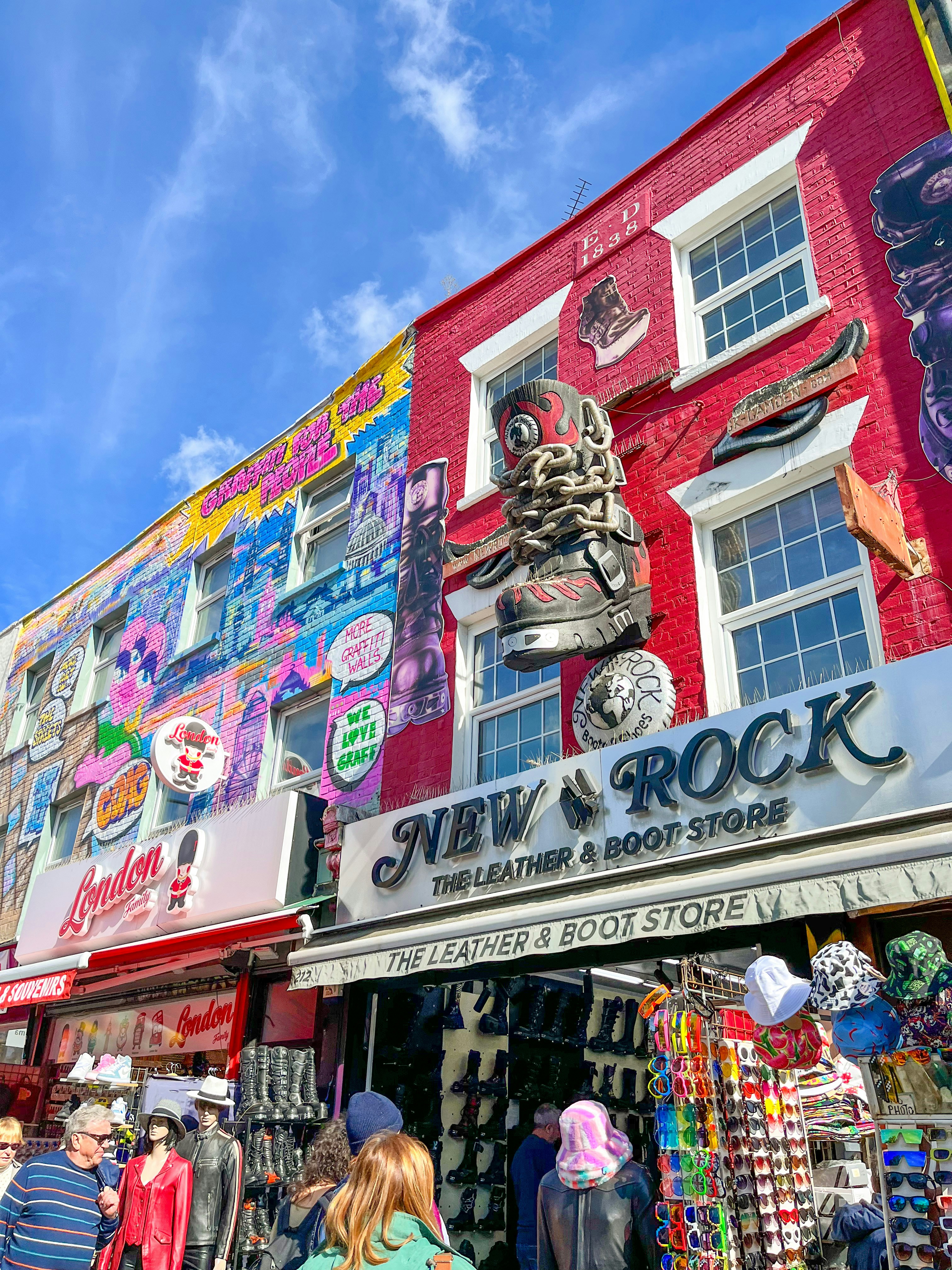 Giant Sneaker Sculpture Crowns a Rainbow Graffiti Facade