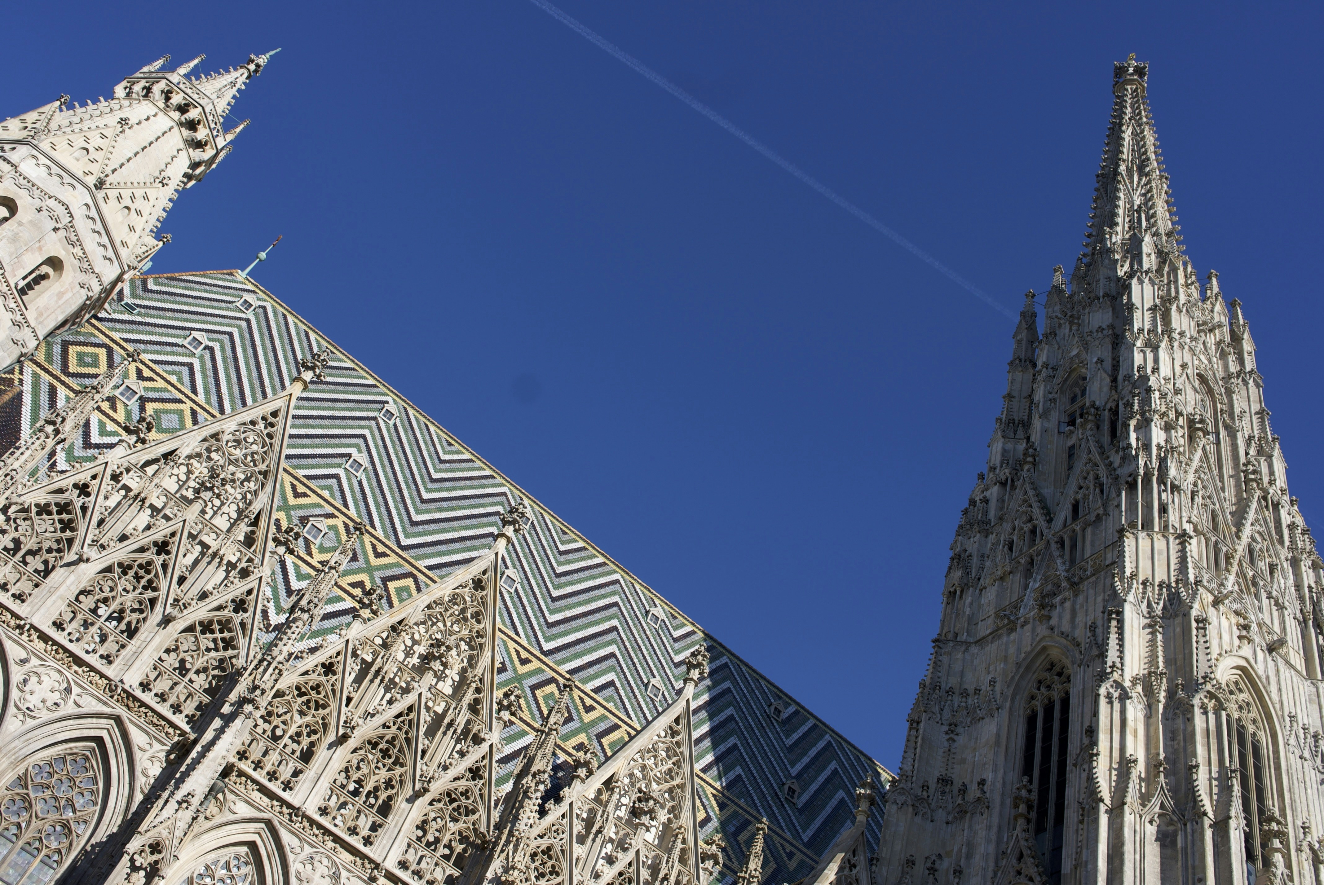 Spire Among Tessellated Facades Under a Cobalt Sky