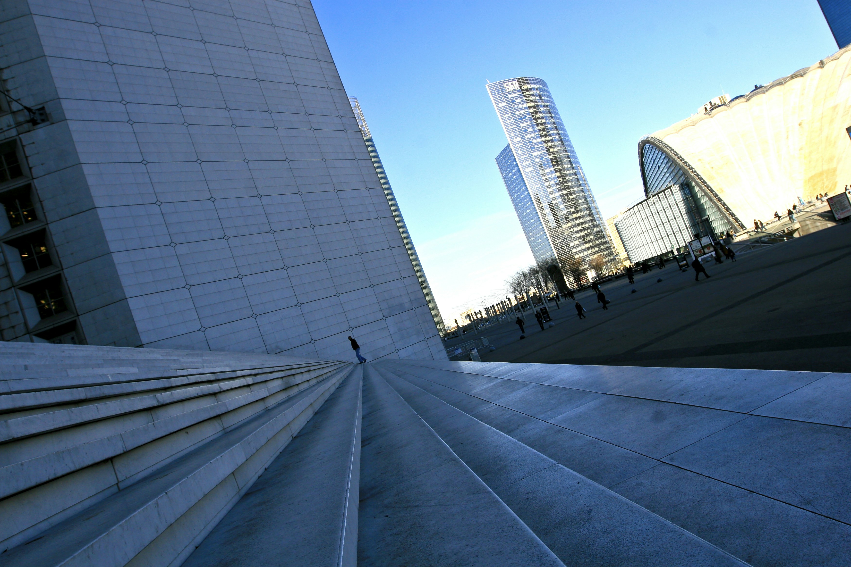 Tilted Concrete Staircase Reaching for a Cerulean Cityscape
