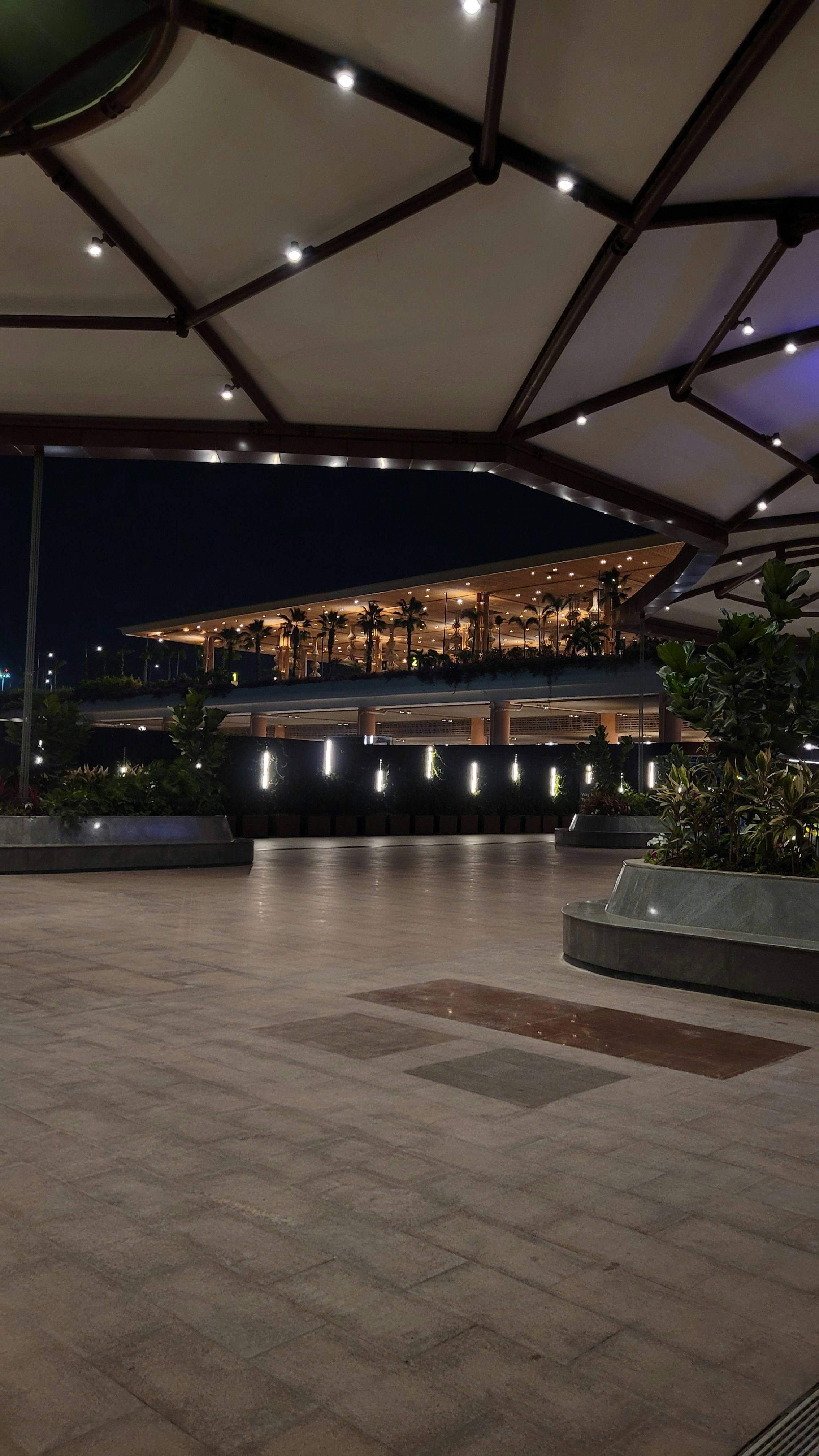 A large open area with a building in the background photo – Free ...