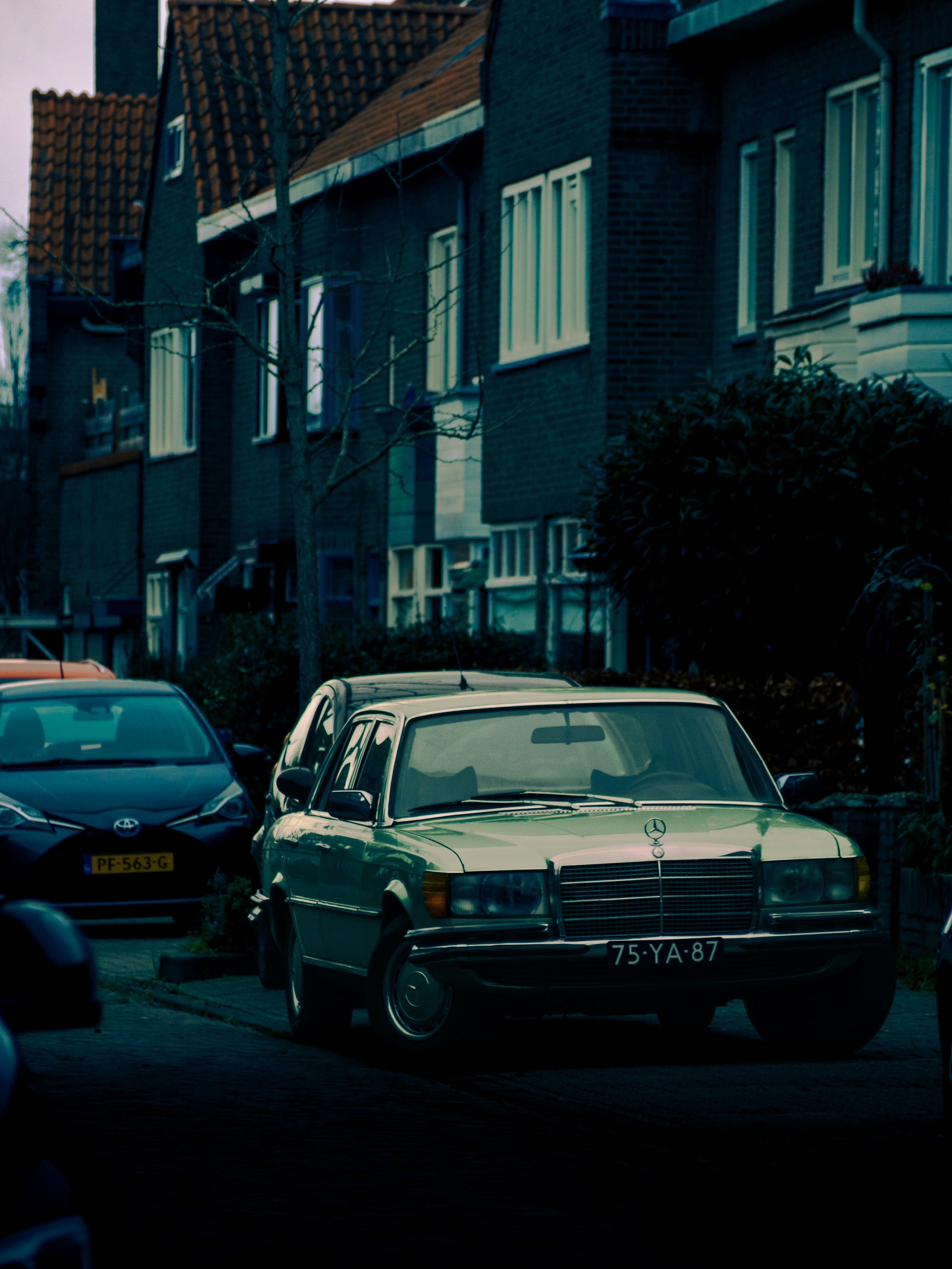 Muted Blues on a Dutch Street: A Vintage Mercedes in Evening Quiet