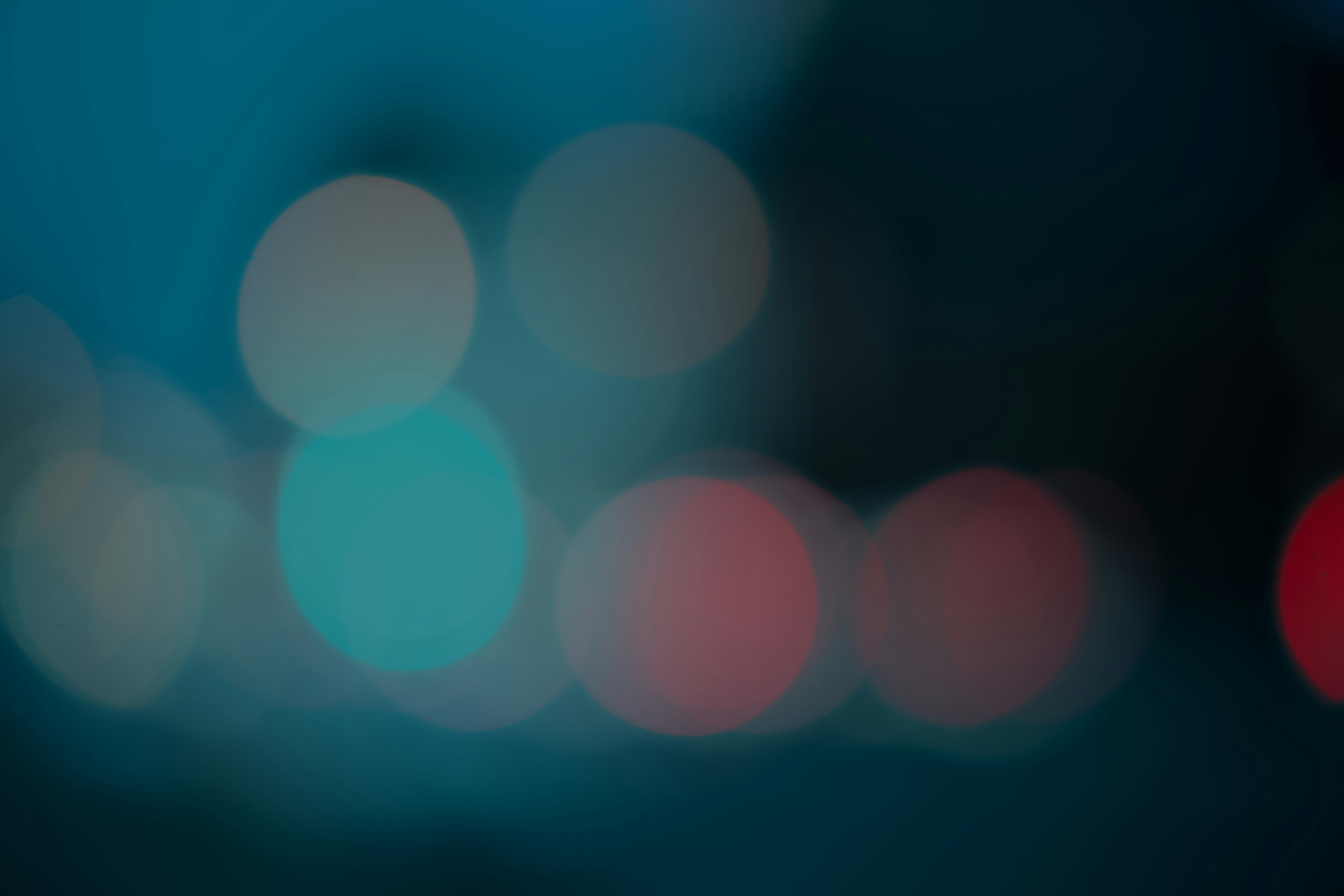 Abstract portrayal of city lights at night, featuring vibrant bokeh effects that evoke a sense of movement and energy.