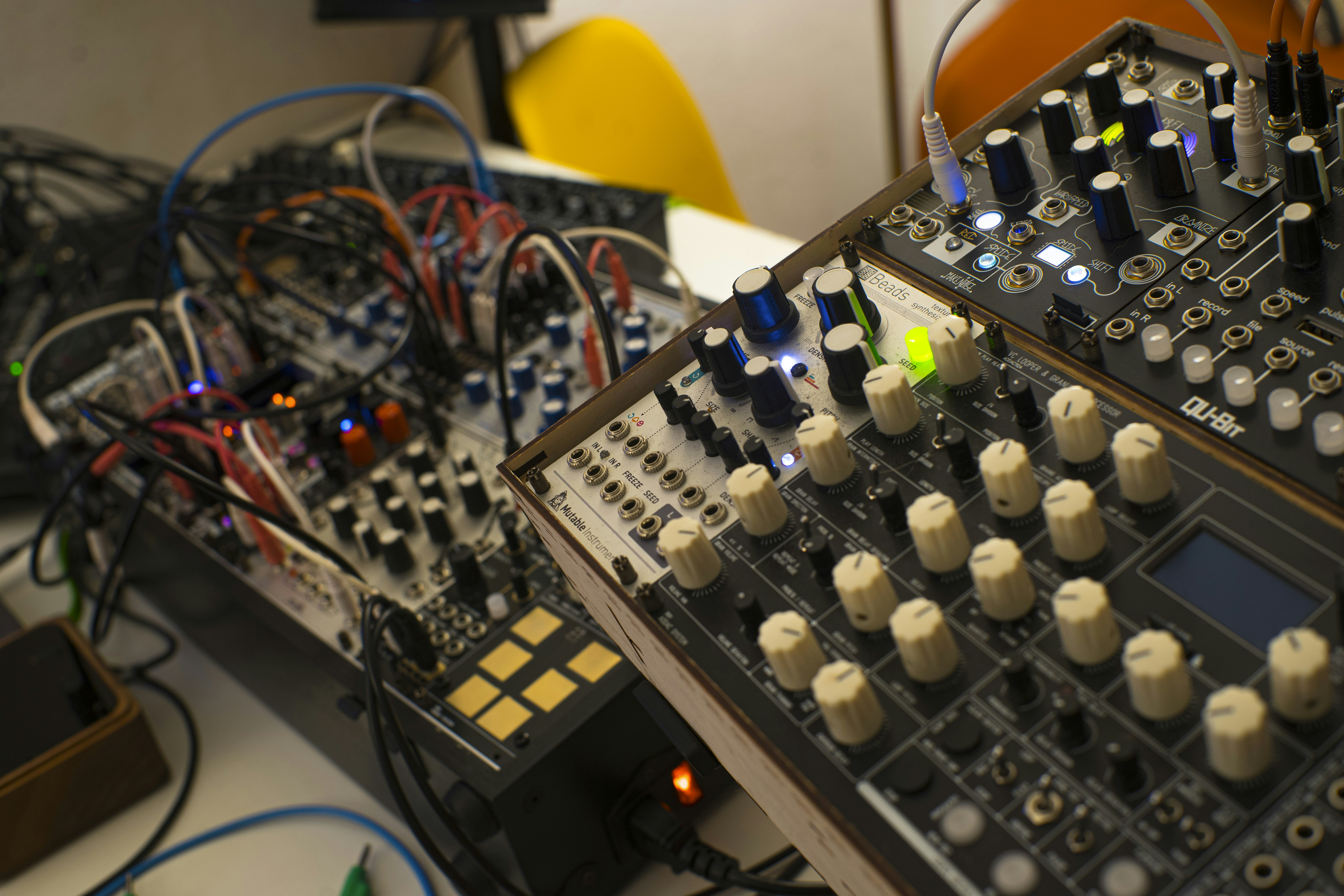 A sound mixing console with many knobs and wires photo – Free Olivais ...