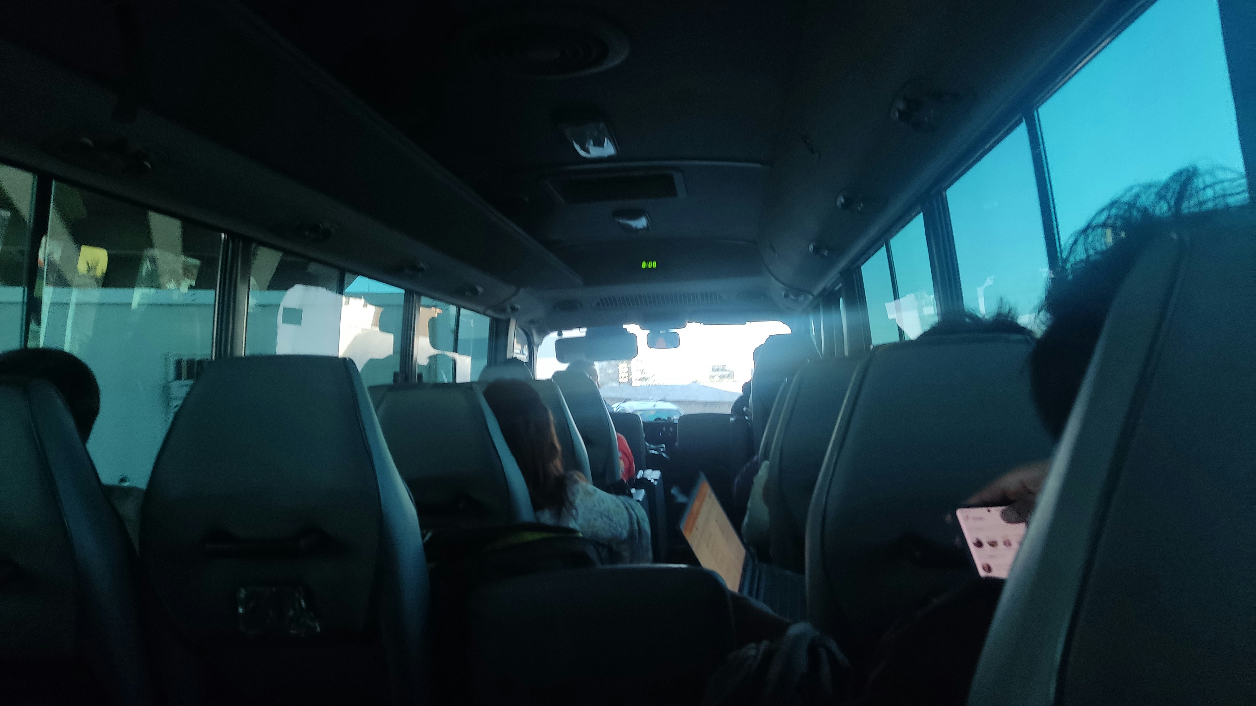 A group of people sitting on a bus next to each other photo – Free ...