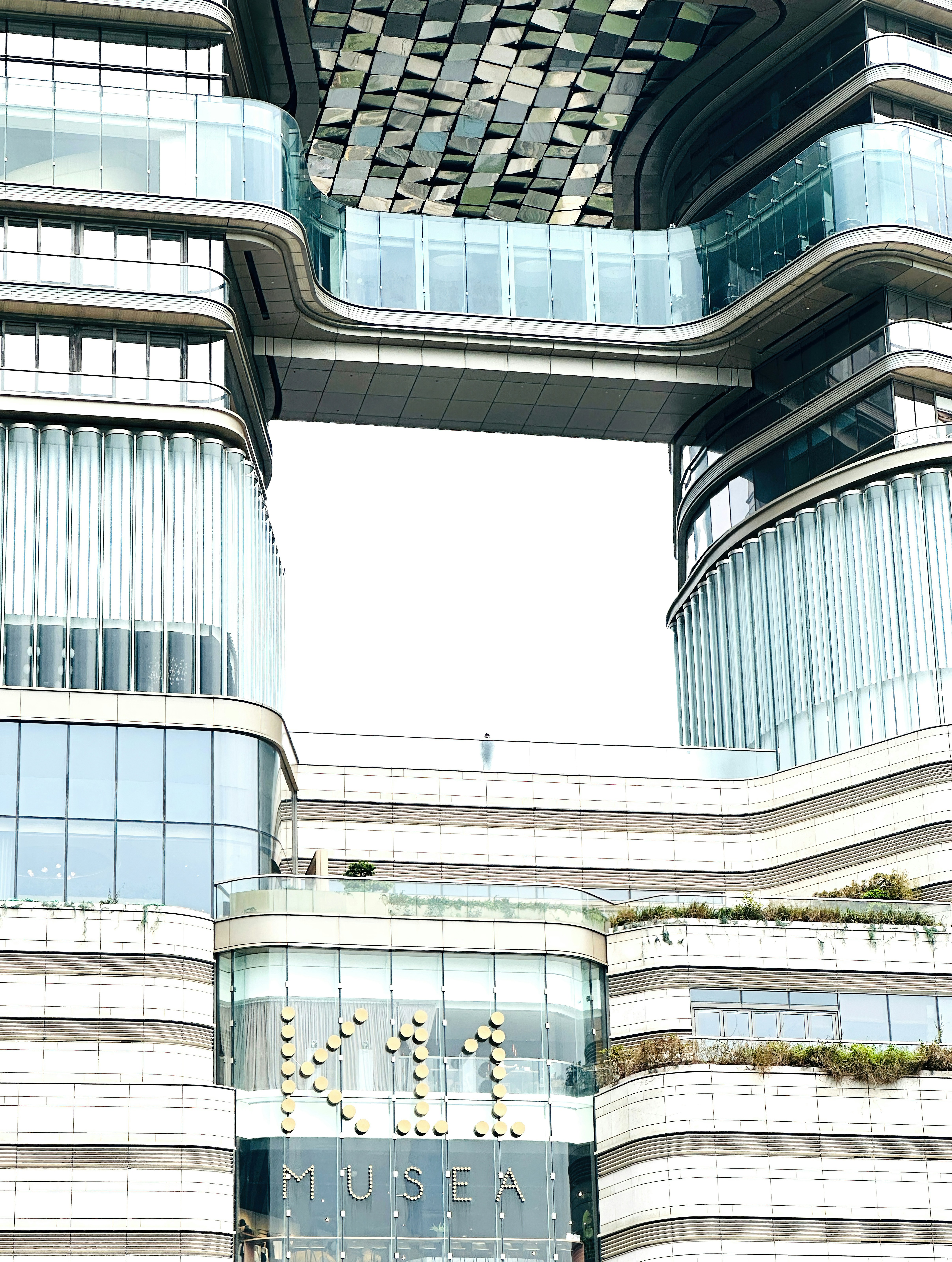 Skygap Atrium: A Glass Bridge Framing Light