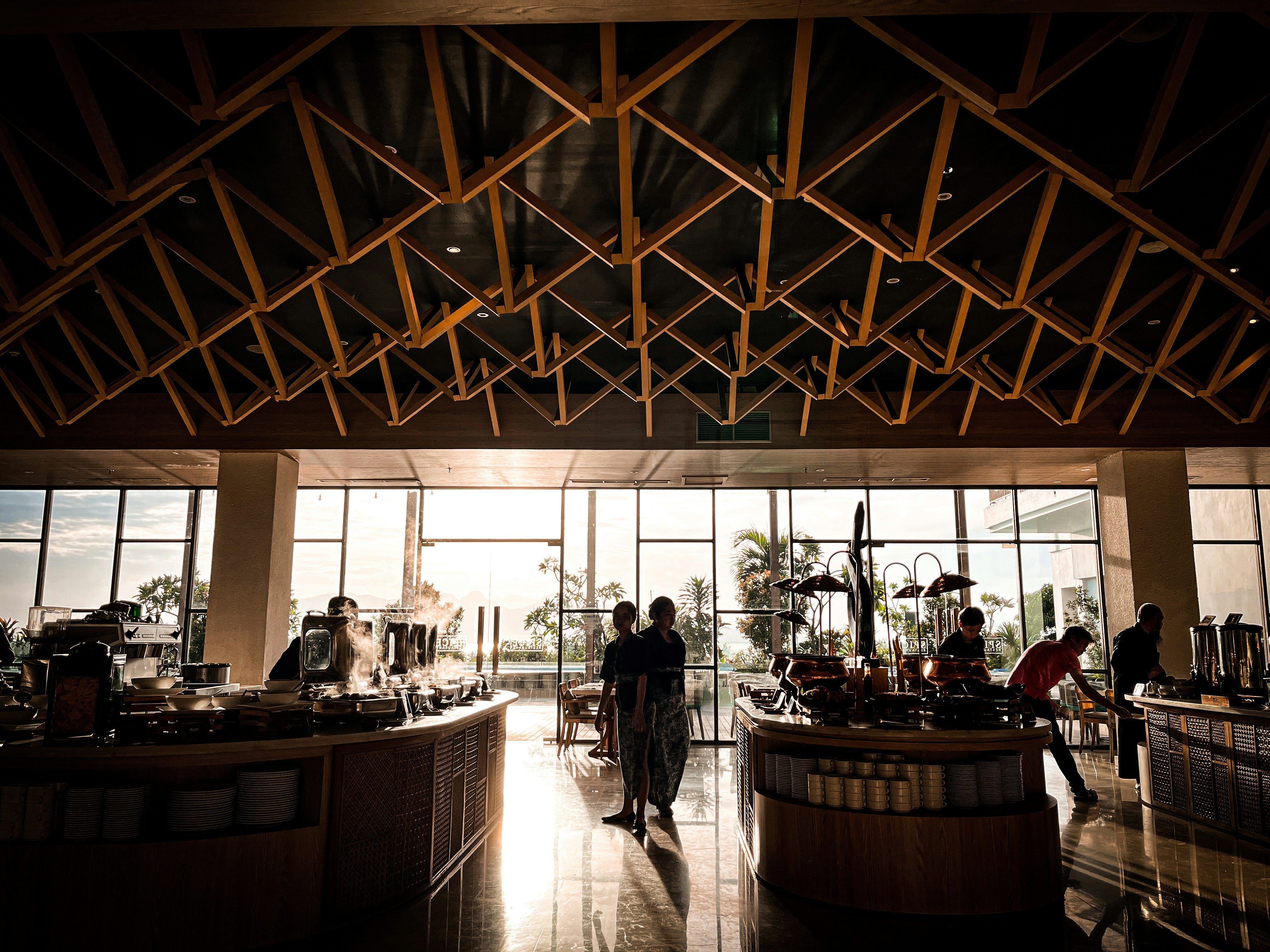 Morning Silhouettes in a Lattice-Ceiling Café