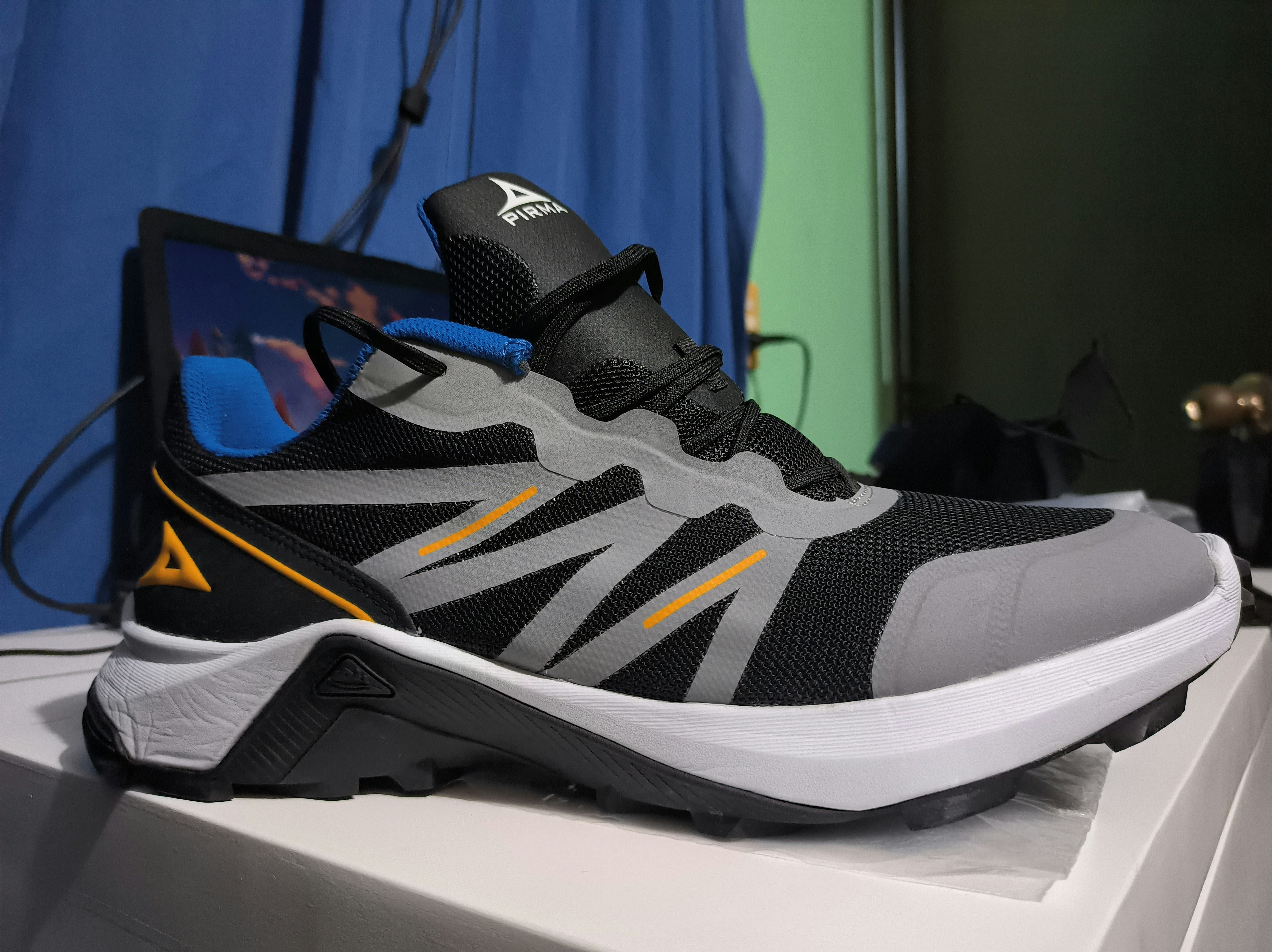 Grey Mesh Runner with Neon Orange Accents: A Studio Shoe Portrait