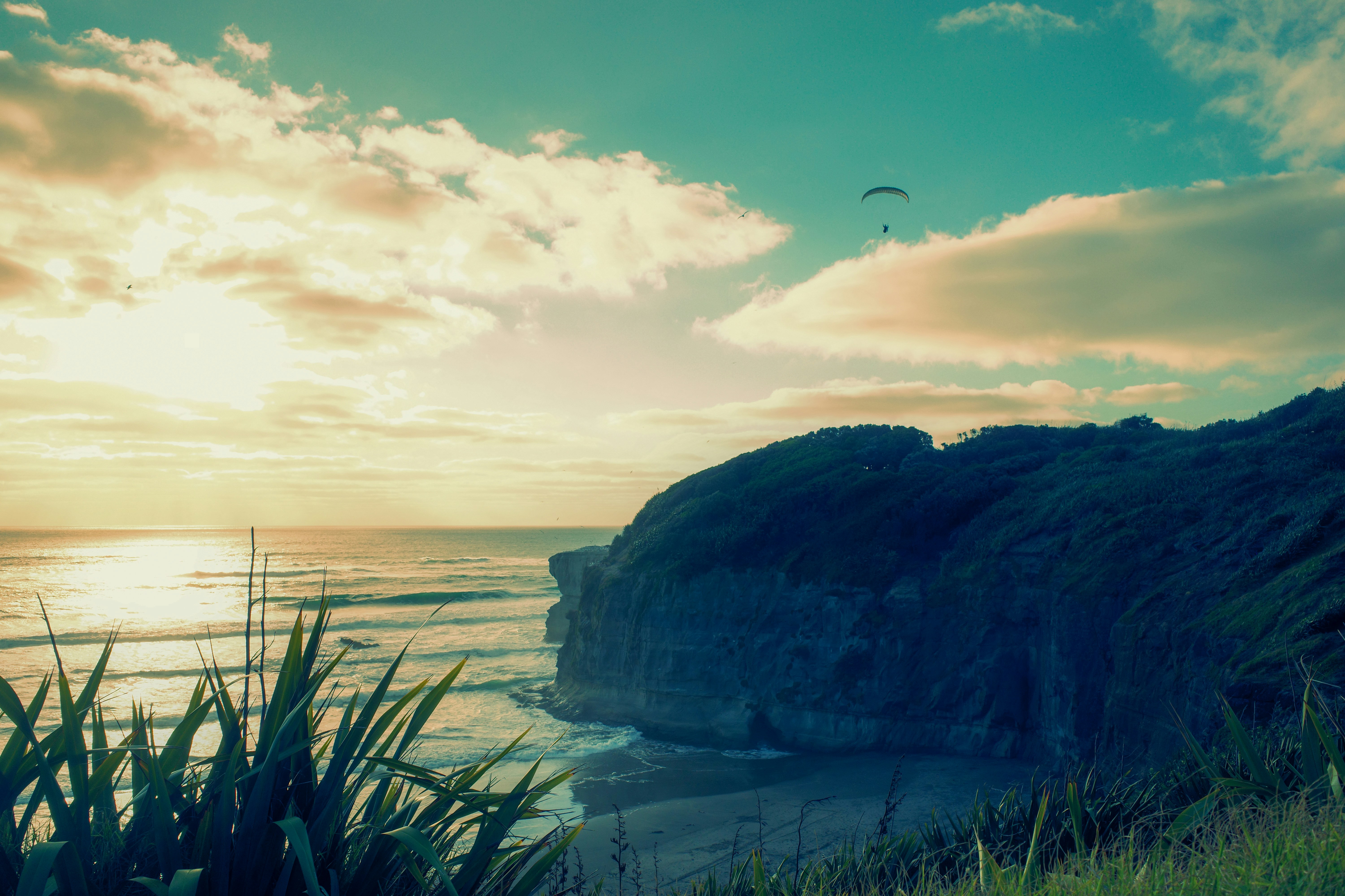 Sunlit cliffs and seaside plateau at dusk